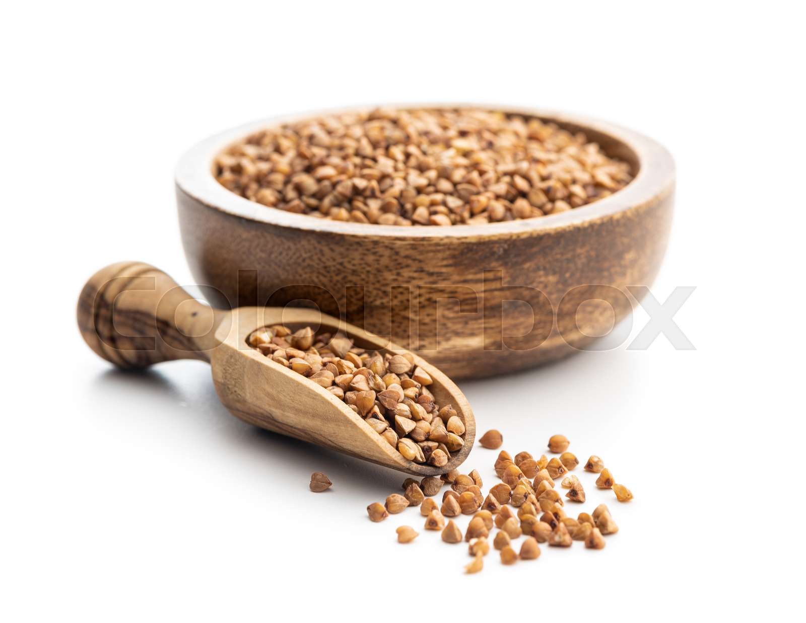Uncooked buckwheat grain in scoop isolated on white background. | Stock ...