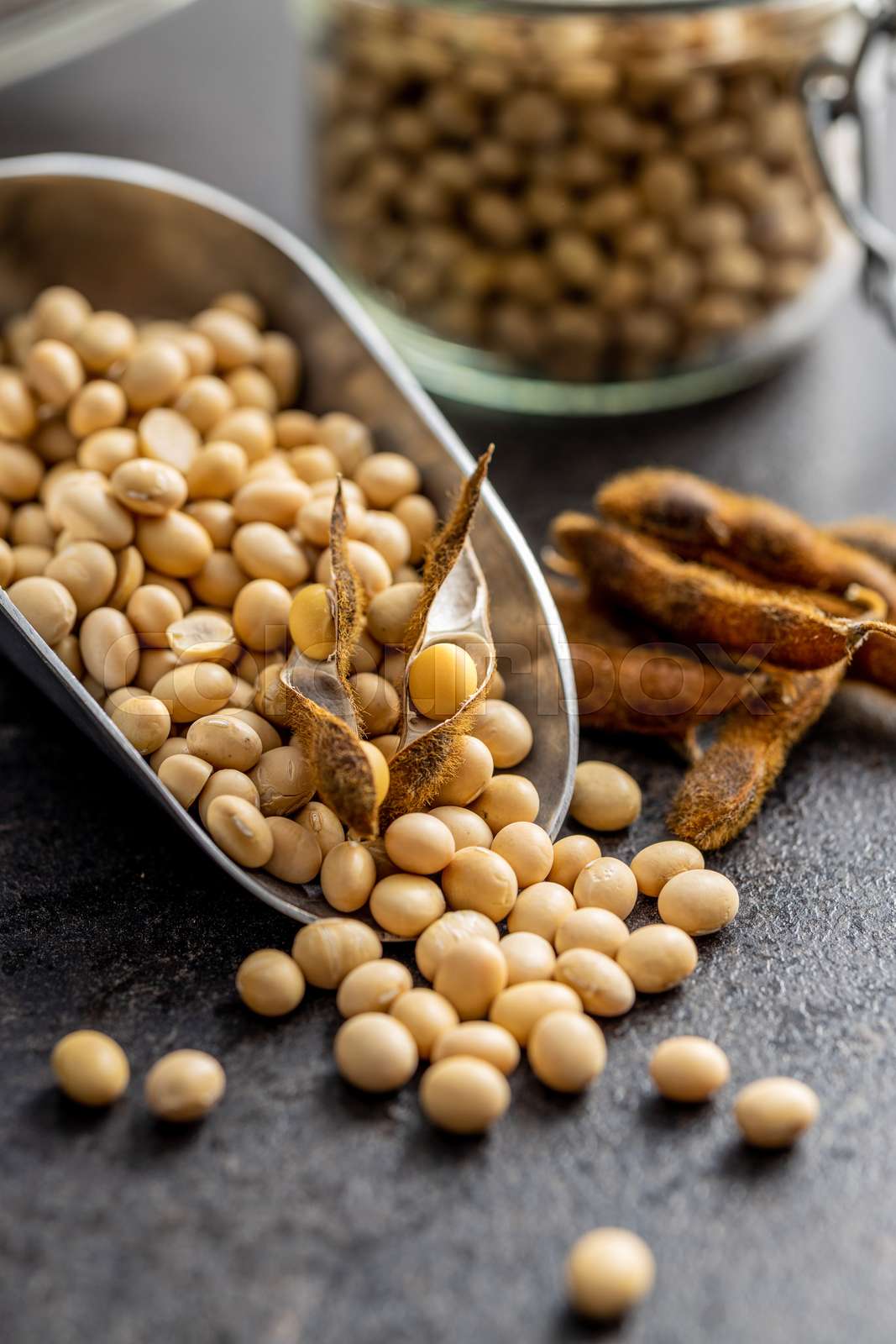 Soy beans. Dried soybean pod in scoop on black table. | Stock image ...