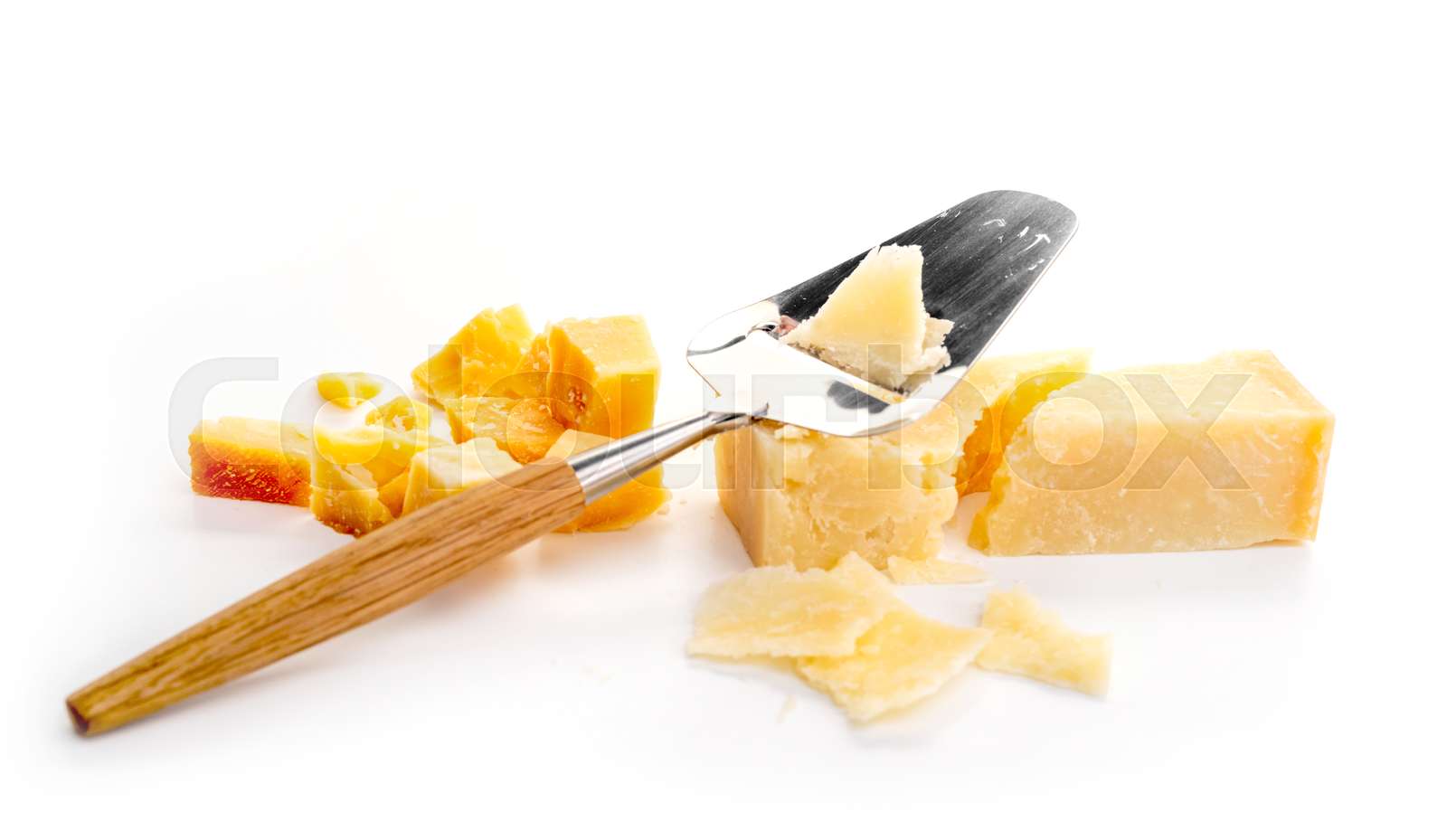 Piece of parmesan cheese on white | Stock image | Colourbox