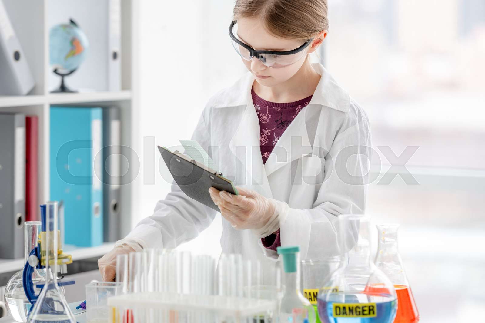 Girl on chemistry lesson | Stock image | Colourbox
