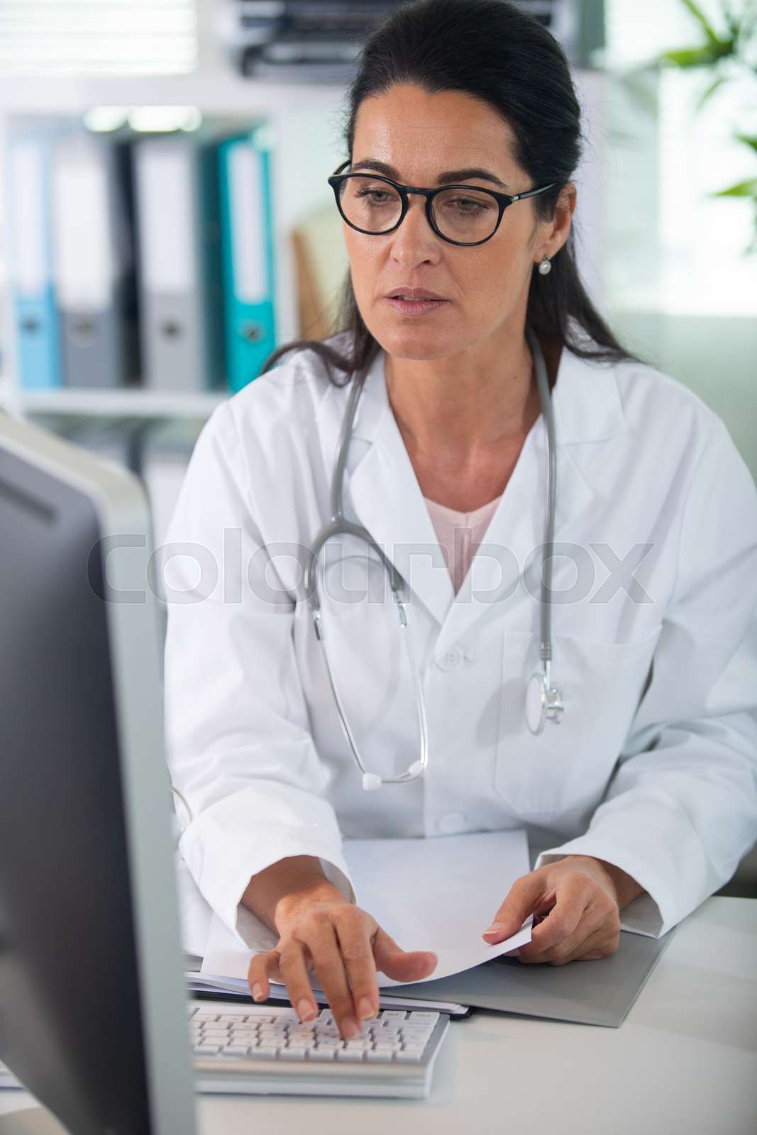 professional female doctor using a computer | Stock image | Colourbox