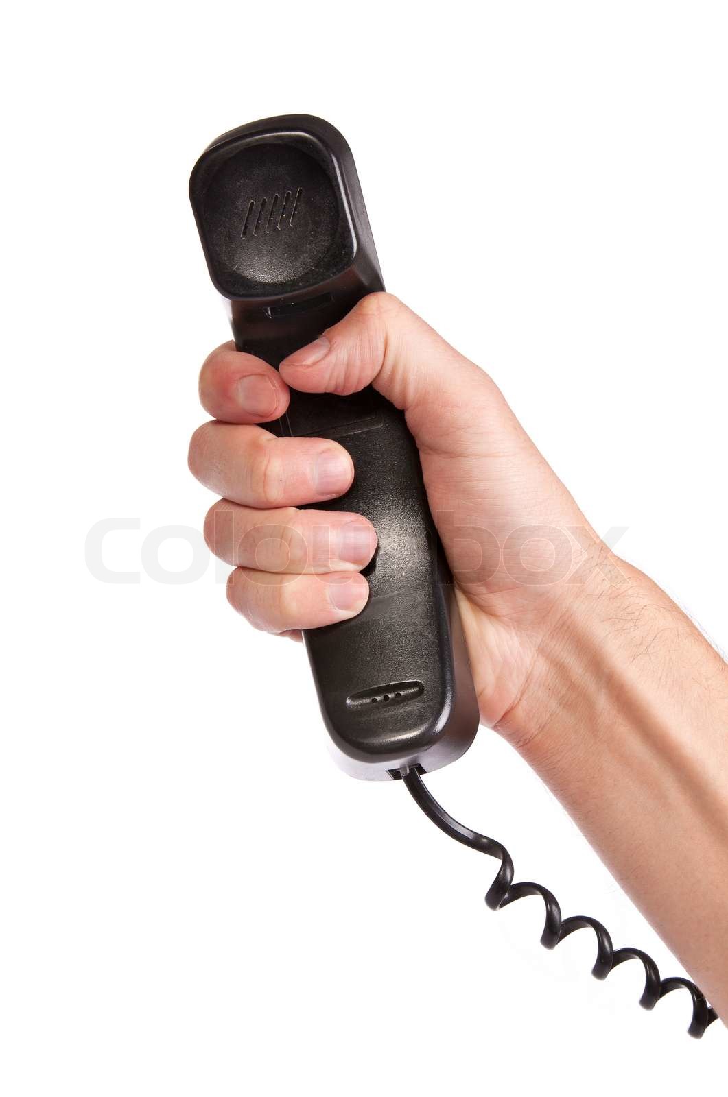 Hånd, der holder en gammel sort telefon rør | Stock foto | Colourbox