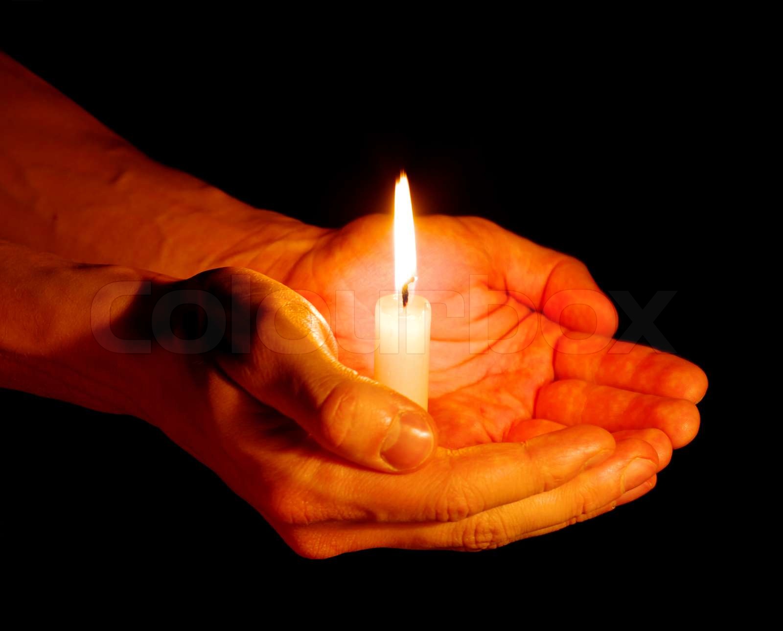 candle in a hand | Stock image | Colourbox
