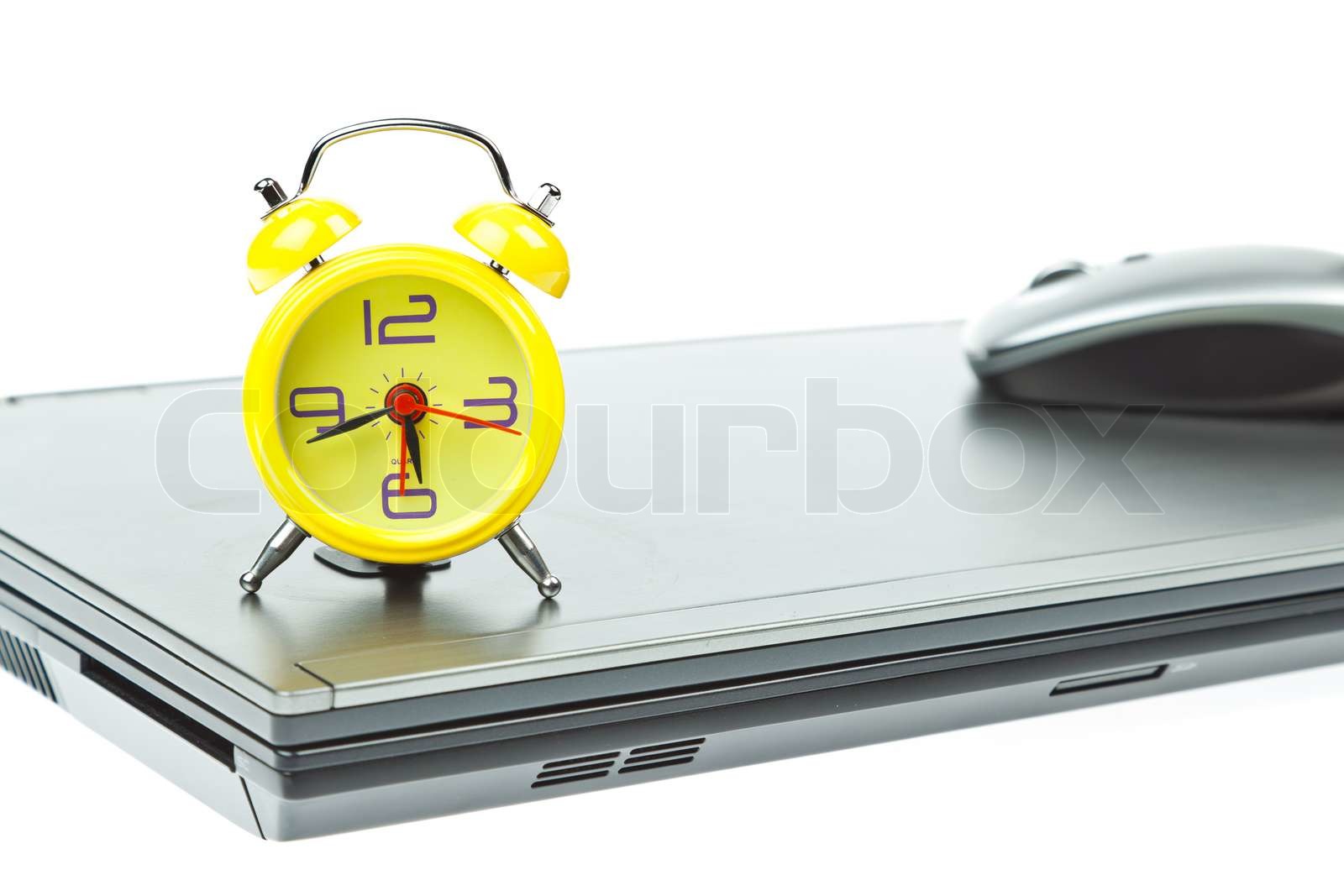 Clock on Notebook as time management concept | Stock image | Colourbox