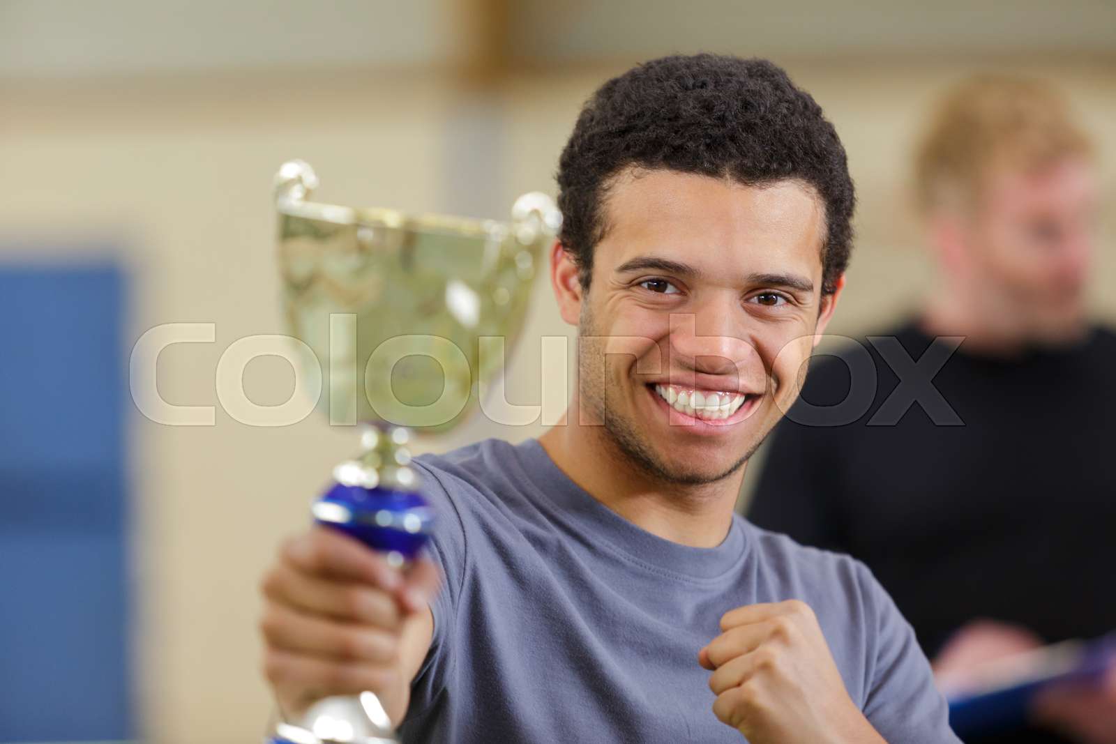 man with a trophy on hands | Stock image | Colourbox