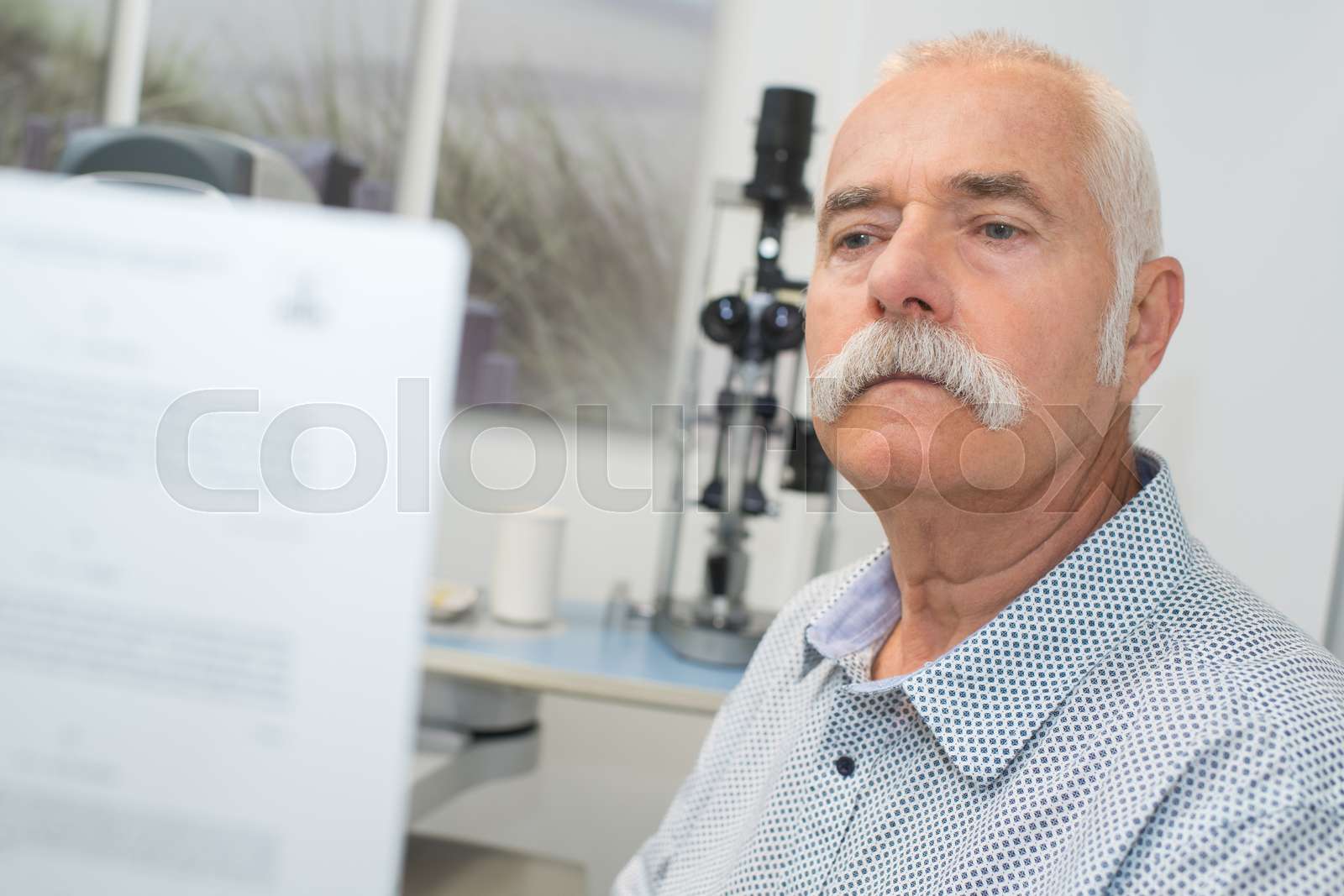 Senior Man Reading Text During Eye Test Stock Image Colourbox senior-man-reading-text-during-eye-test-stock-image-colourbox