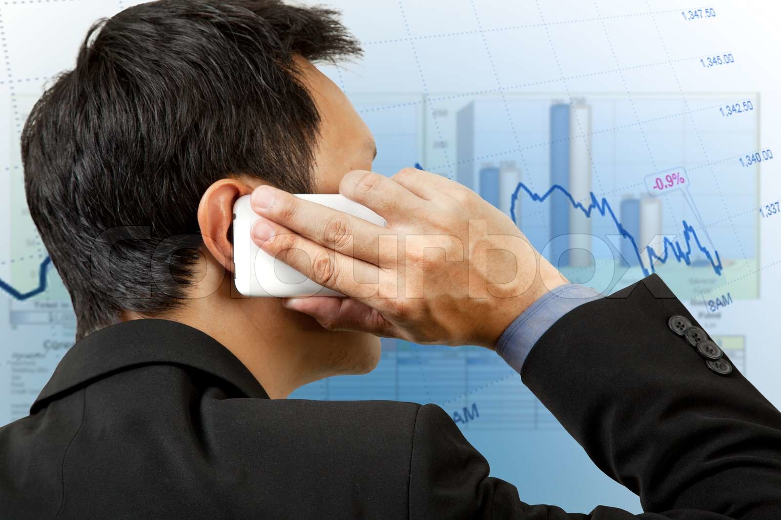 Financial businessman on phone reporting | Stock image | Colourbox