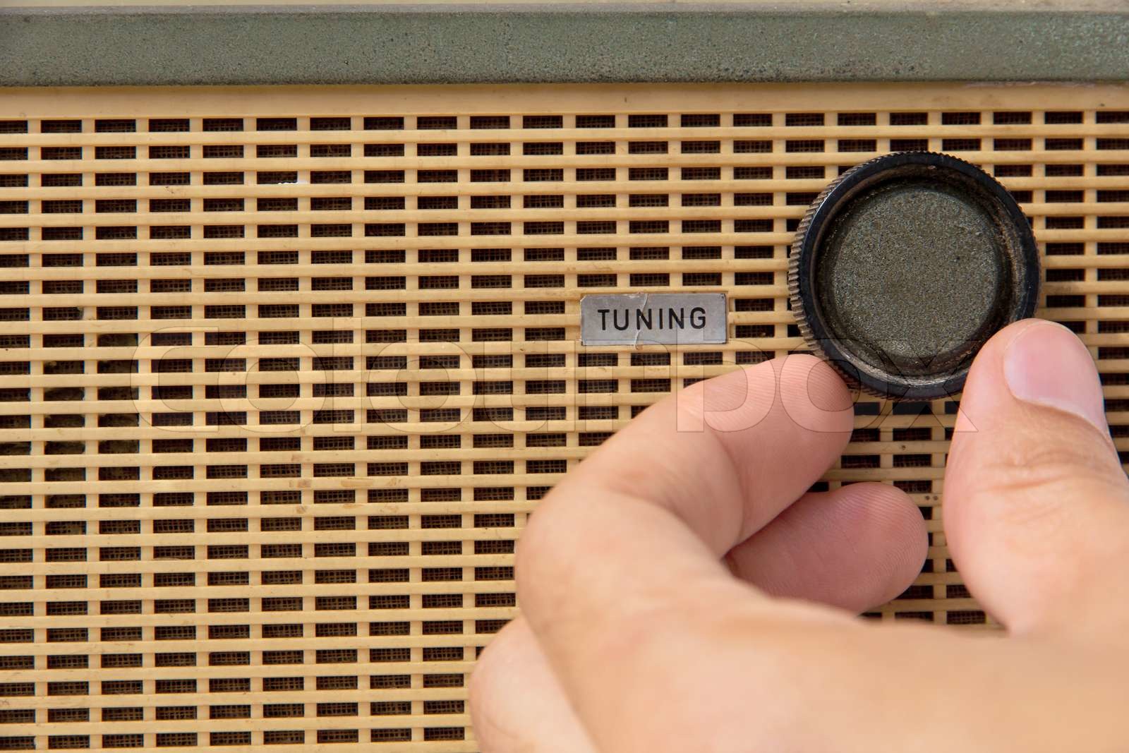 hand with tuner radio knob | Stock image | Colourbox
