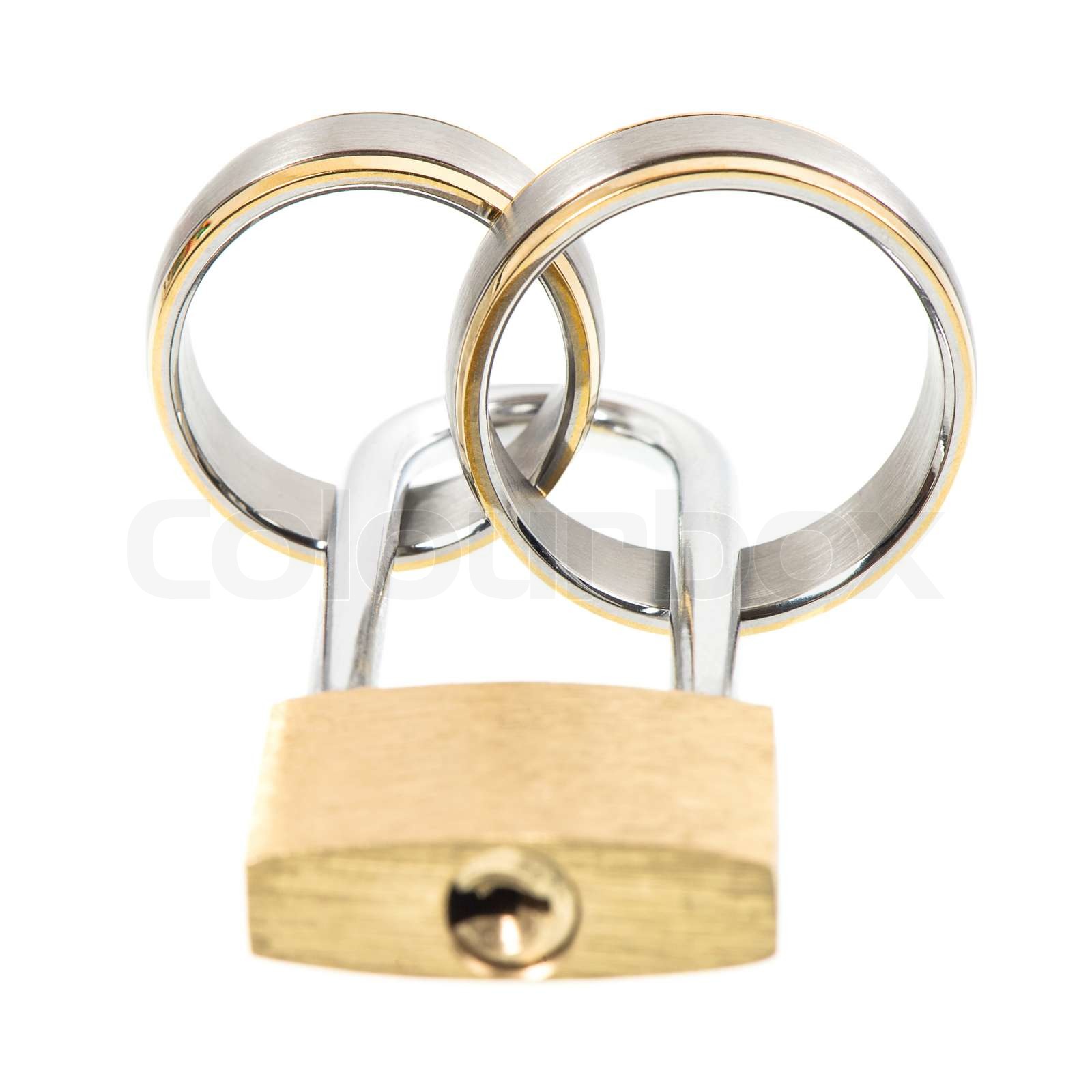wedding rings and key lock over white | Stock image | Colourbox