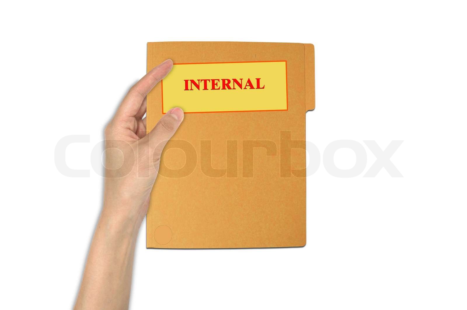 Hand holding internal paper folder | Stock image | Colourbox