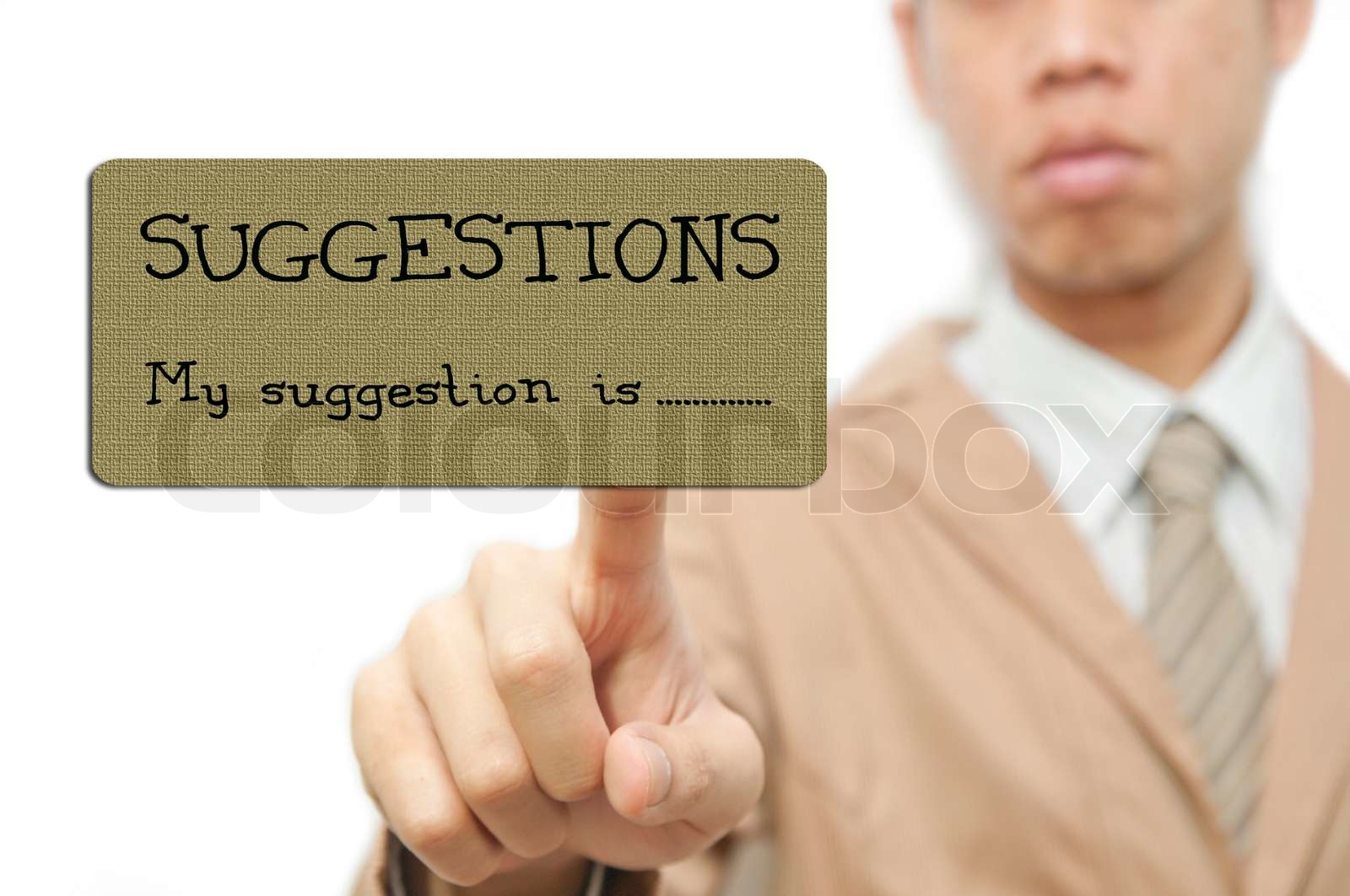 Business man finger pressing a suggestion button | Stock image | Colourbox