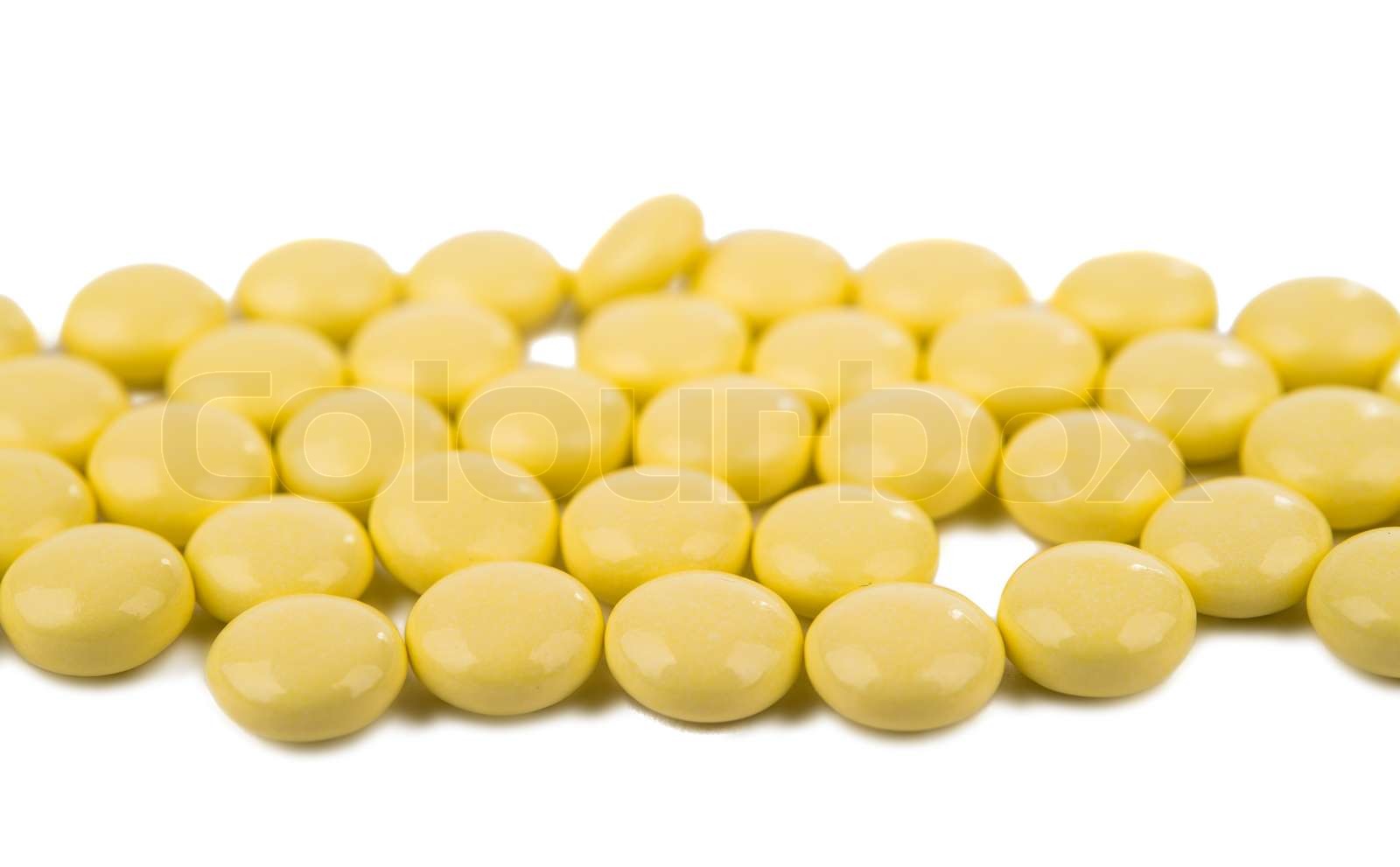 Yellow pills | Stock image | Colourbox
