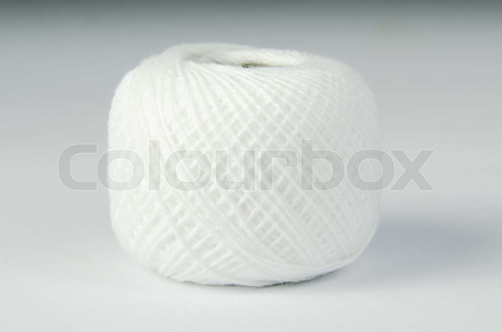 White spool of thread | Stock image | Colourbox