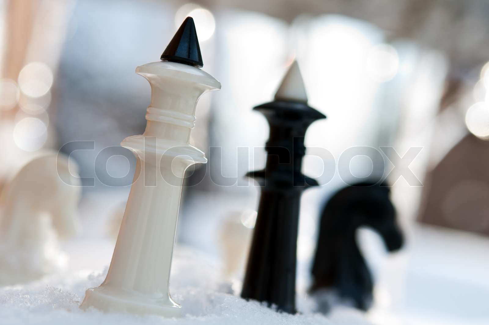chess pieces on snow | Stock image | Colourbox
