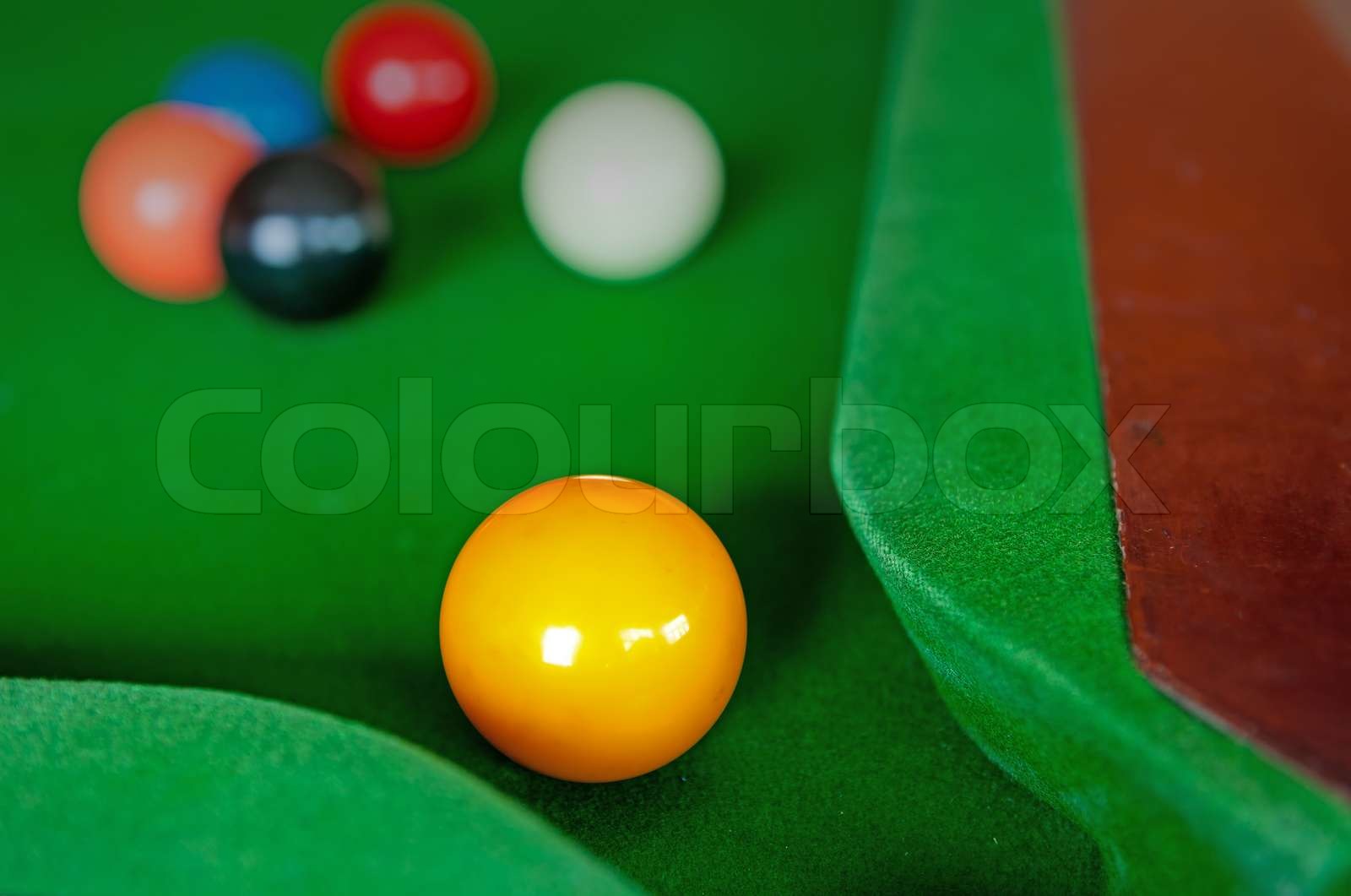 Yellow Snooker Ball near Corner Hole | Stock image | Colourbox