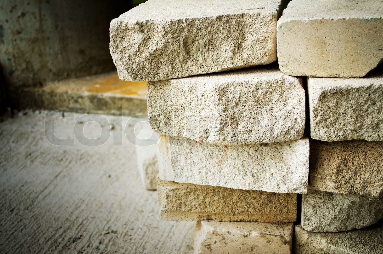 Stack of new white bricks near construction site | Stock image | Colourbox