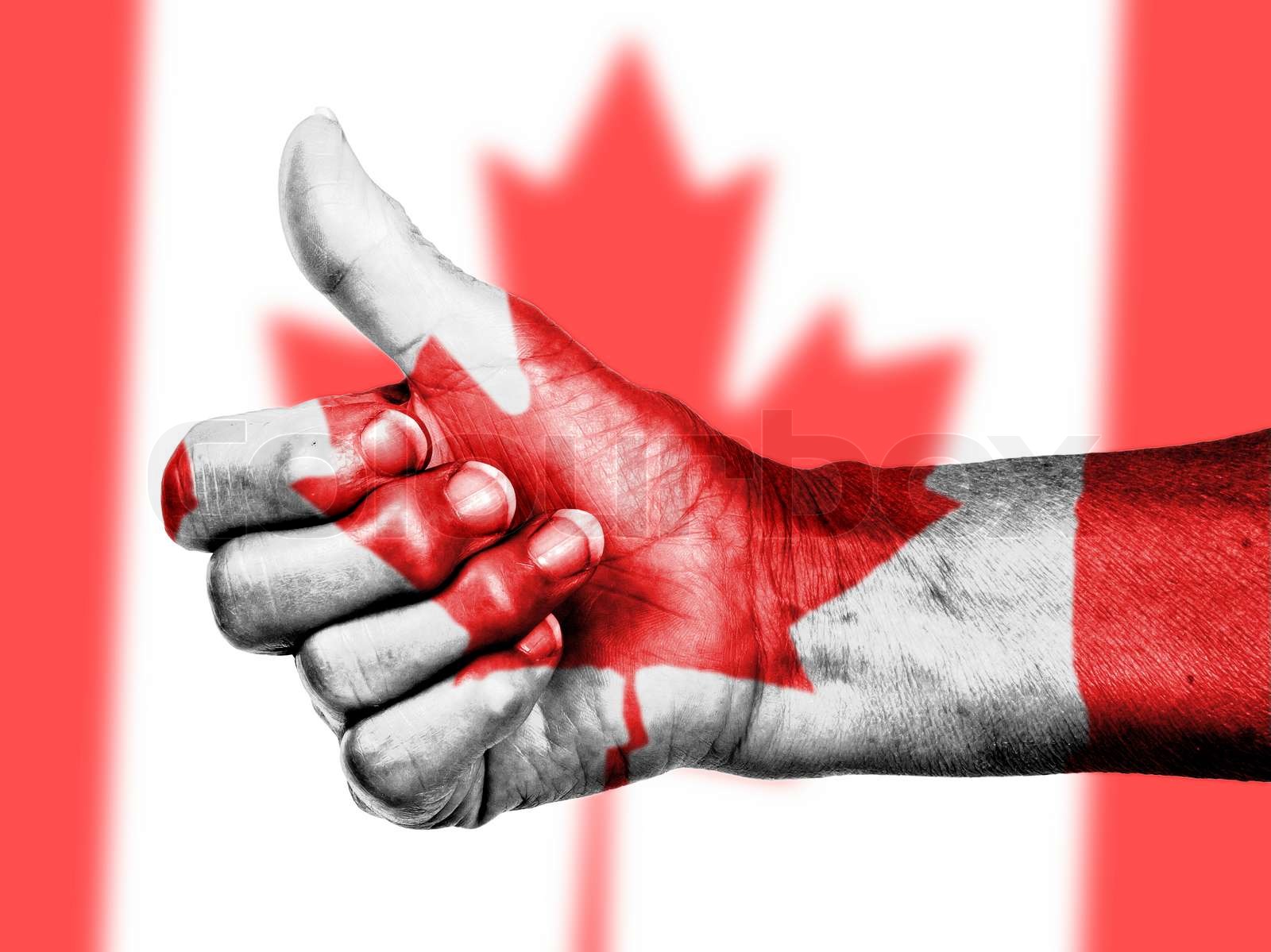 Canadian flag on thumbs up hand | Stock image | Colourbox