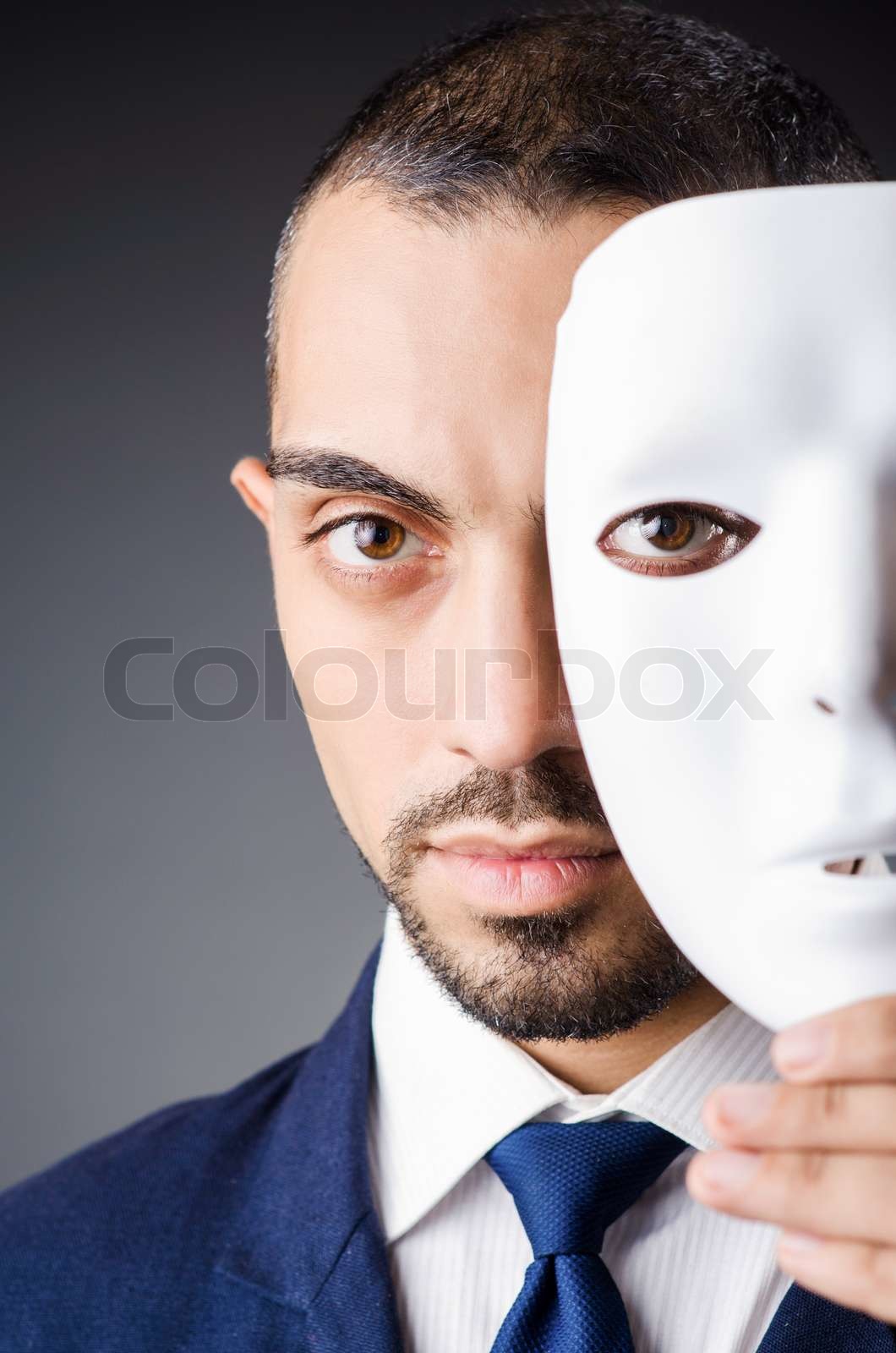 Man with masks in hypocrisy concept | Stock image | Colourbox