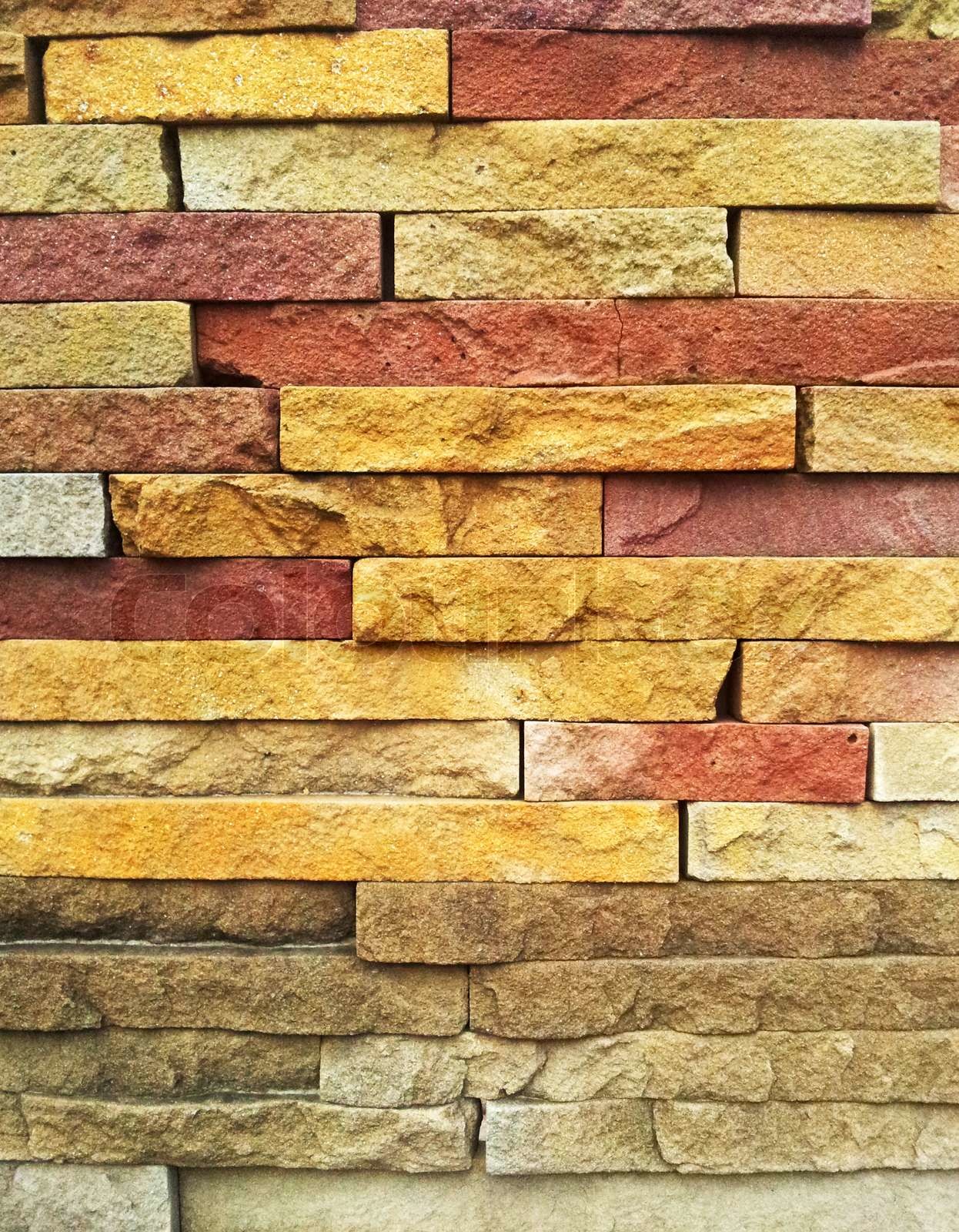 Colorful cut stone wall | Stock image | Colourbox