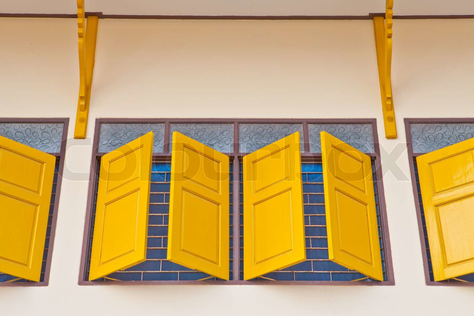 Traditional thai style yellow window | Stock image | Colourbox