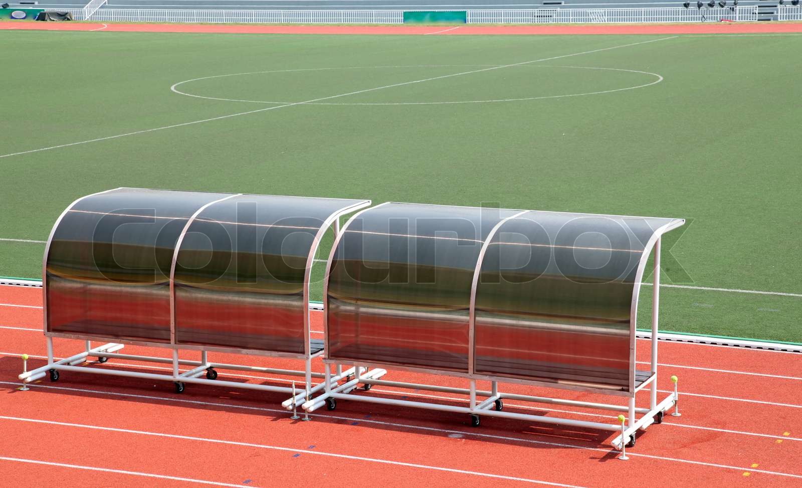 Coach and reserve benches in football stadium | Stock image | Colourbox