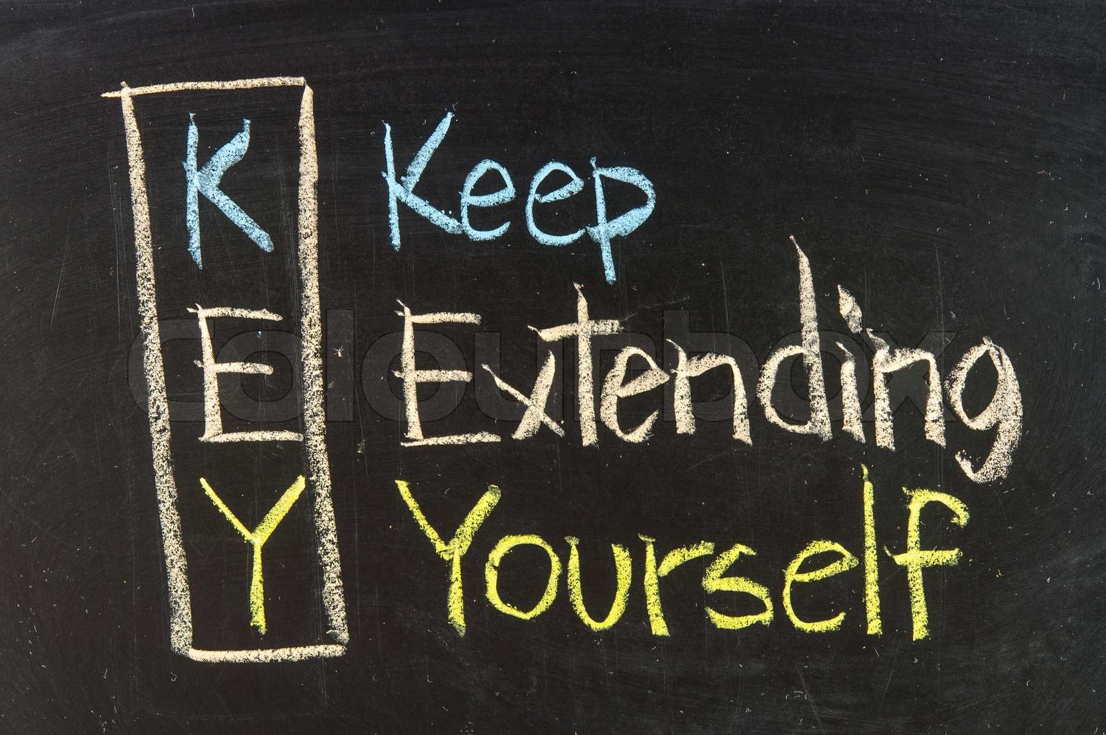 KEY acronym -Keep extending yourself on a blackboard with words written ...