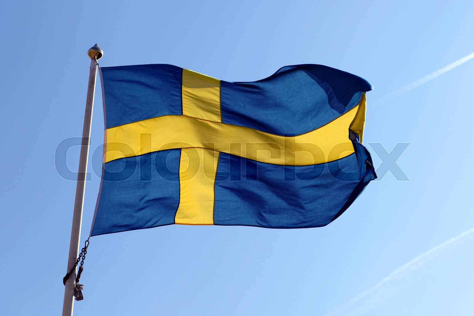 The swedish flag on flag pole | Stock image | Colourbox