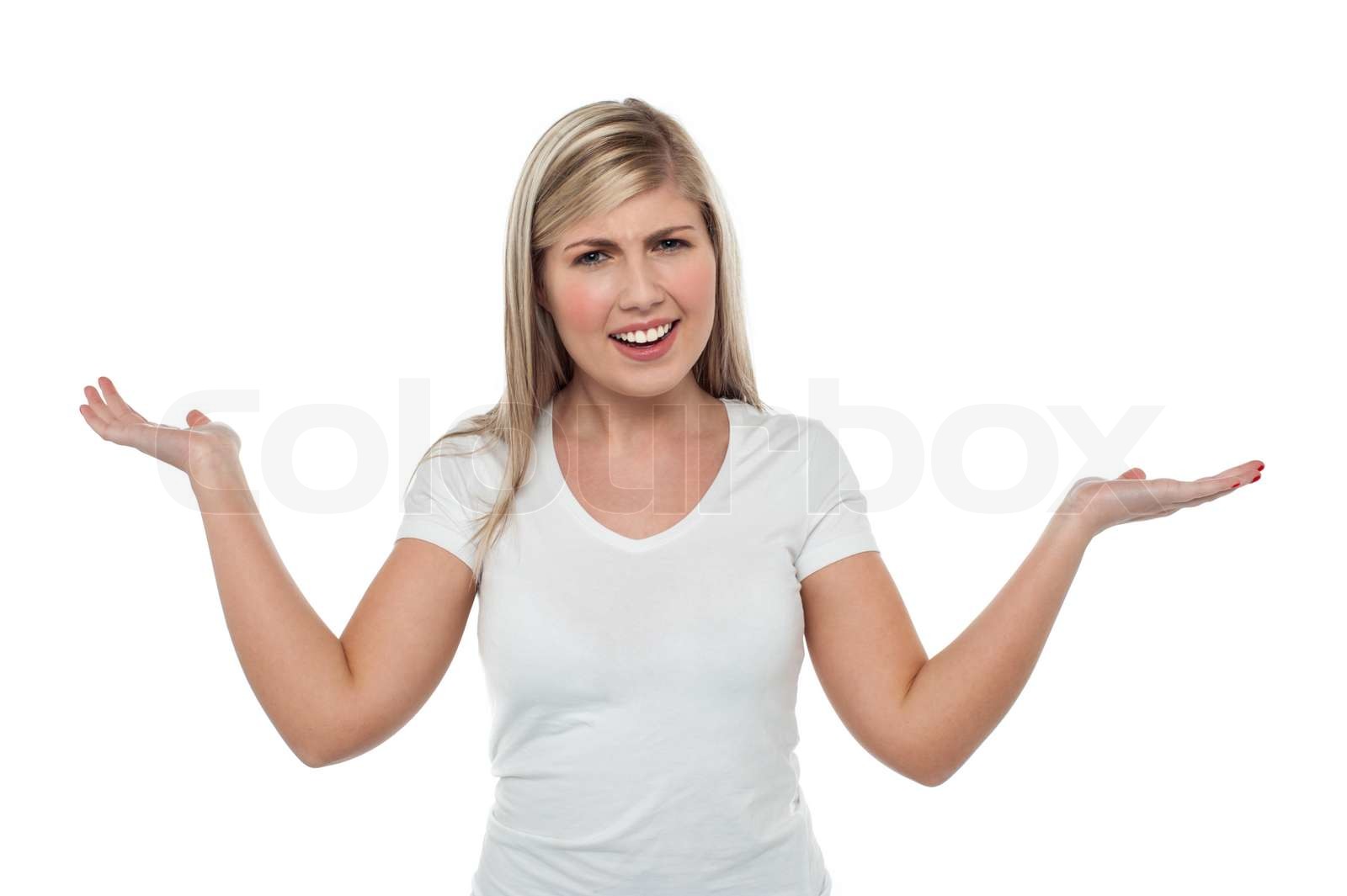 Confused young woman. Mixed expression | Stock image | Colourbox