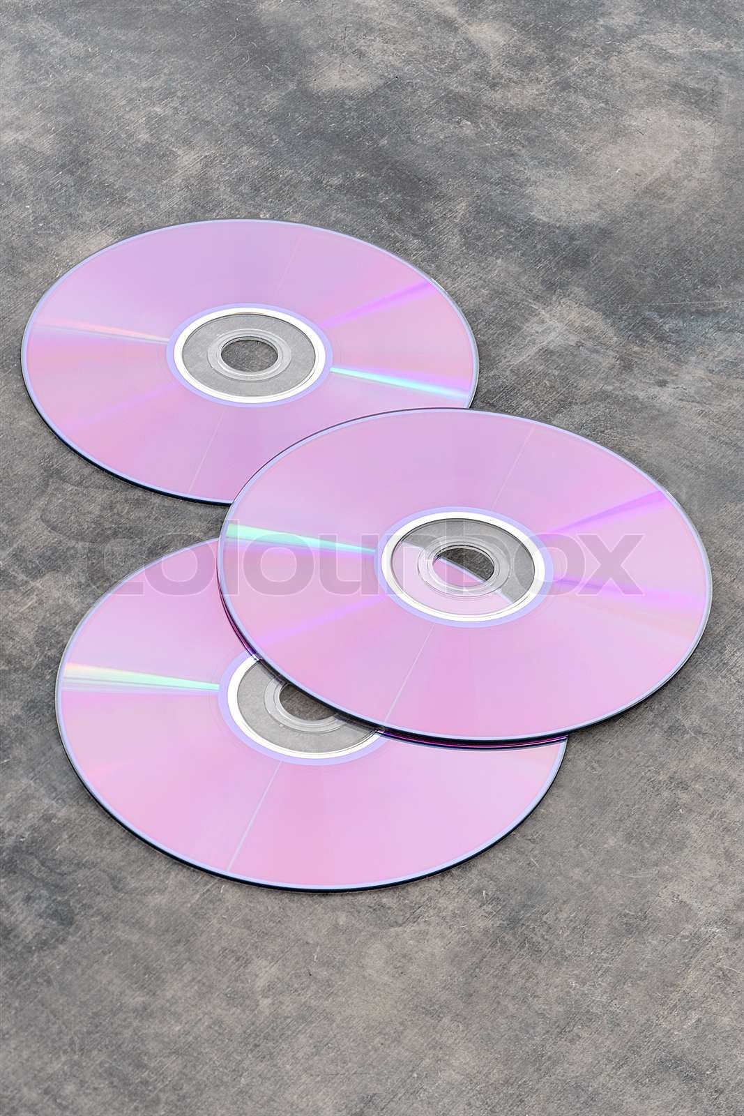 Pink cds on the floor | Stock image | Colourbox