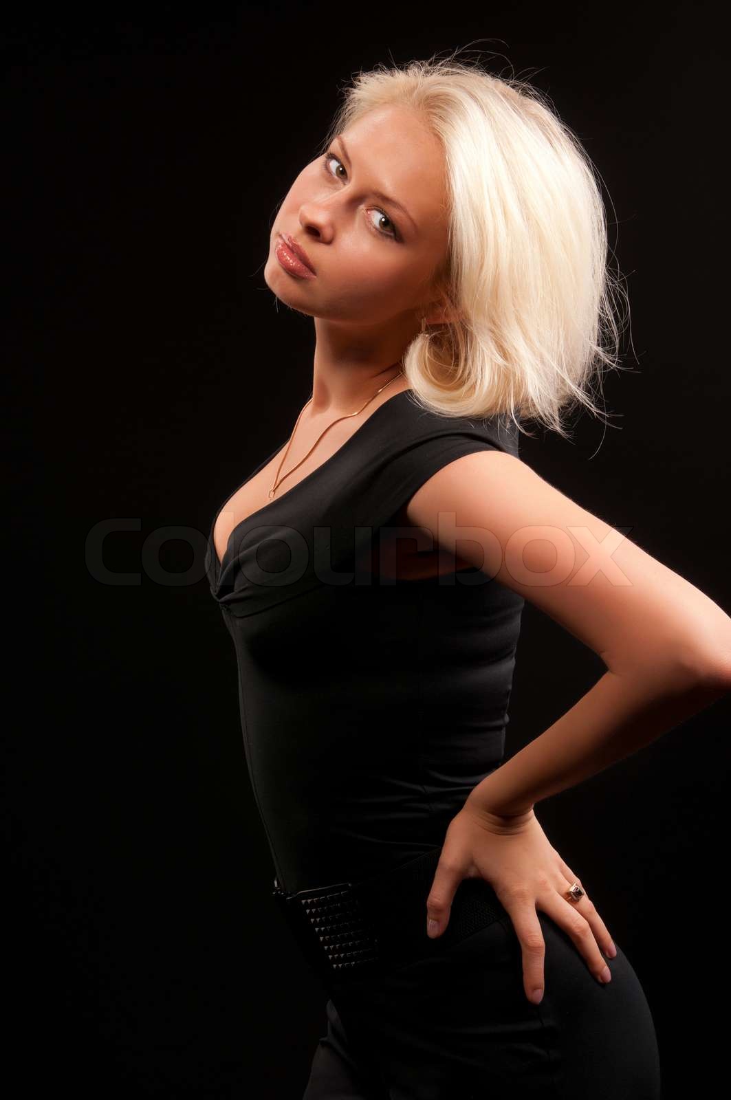 smukke blondine på en sort baggrund | Stock foto | Colourbox