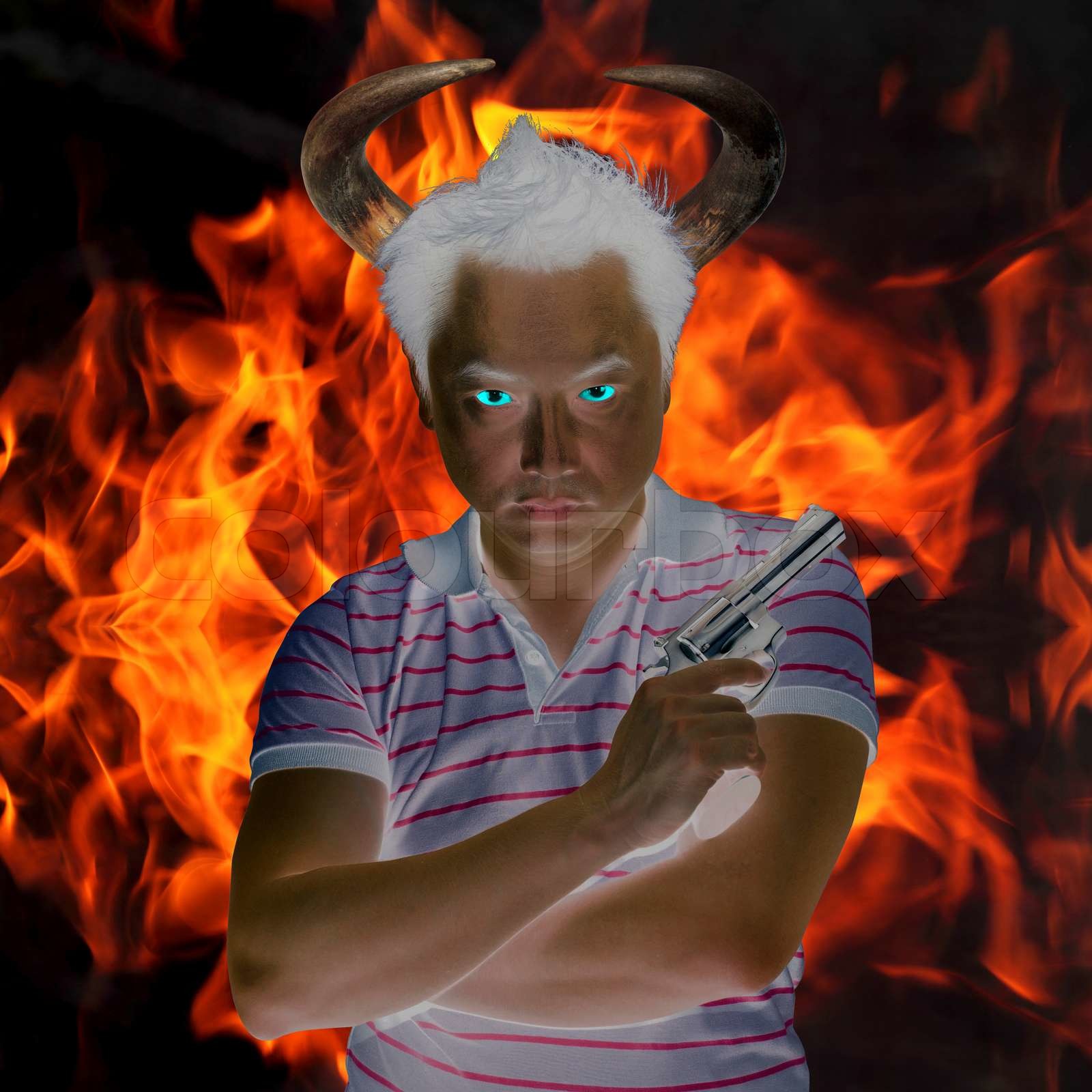 Devil holding gun | Stock image | Colourbox