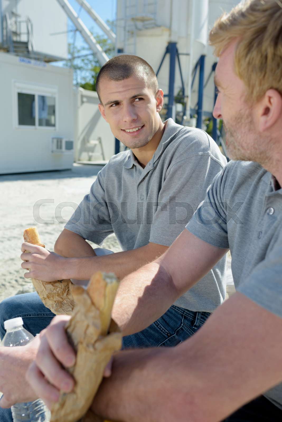 portrait of builders during lunch break | Stock image | Colourbox