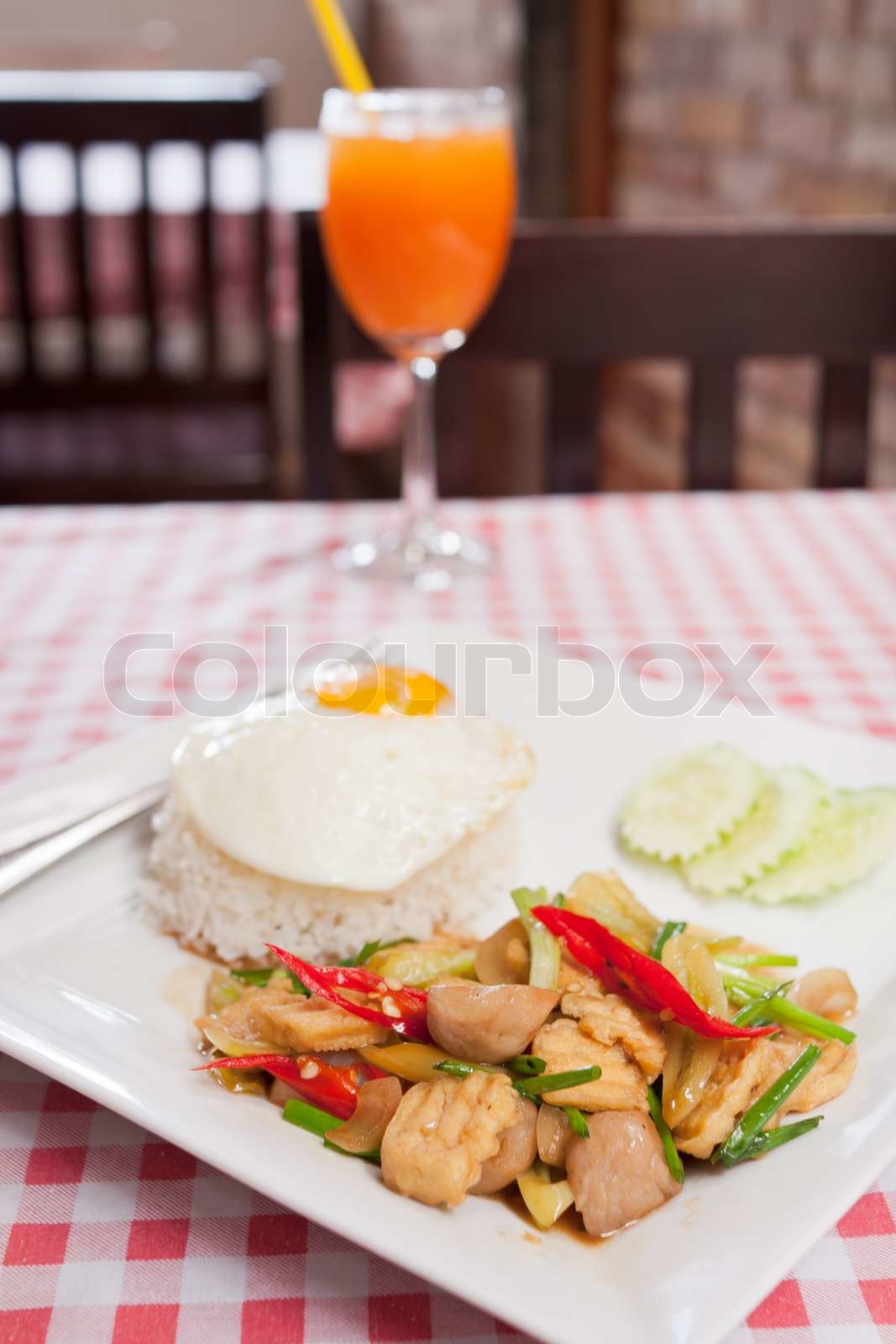 sunny-side up egg on rice with spicy fried vegetable and pork slice ...