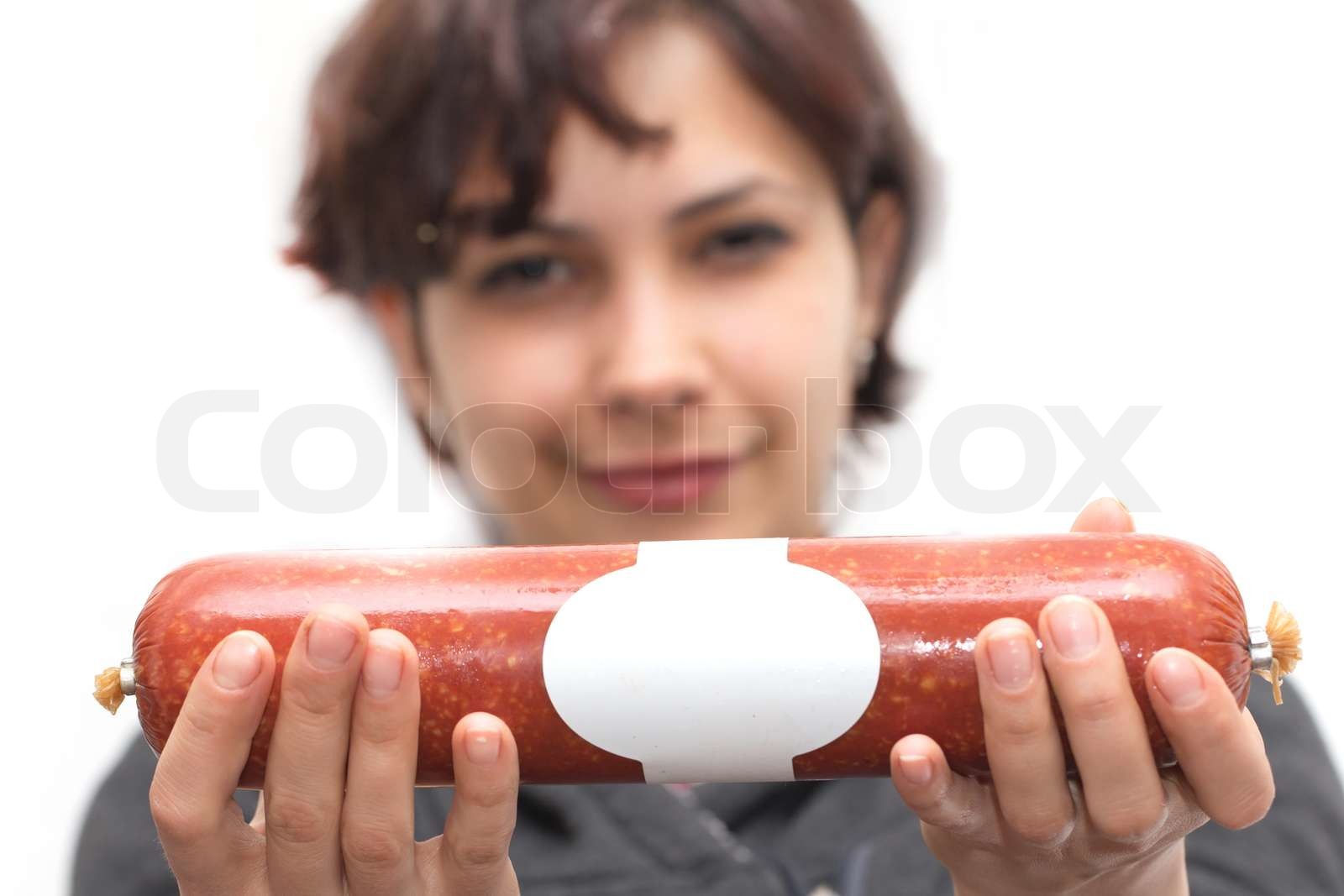 sausage in the girl's hands | Stock image | Colourbox