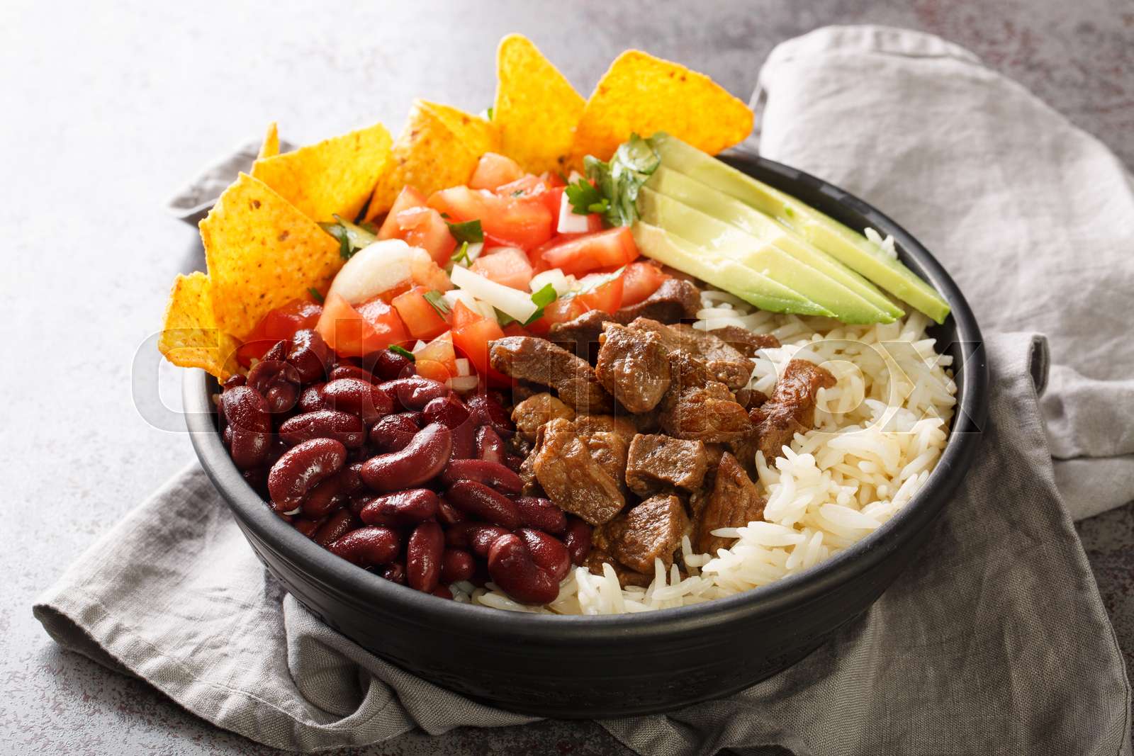 Costa Rican chifrijo is a layered dish of tender beans topped with ...