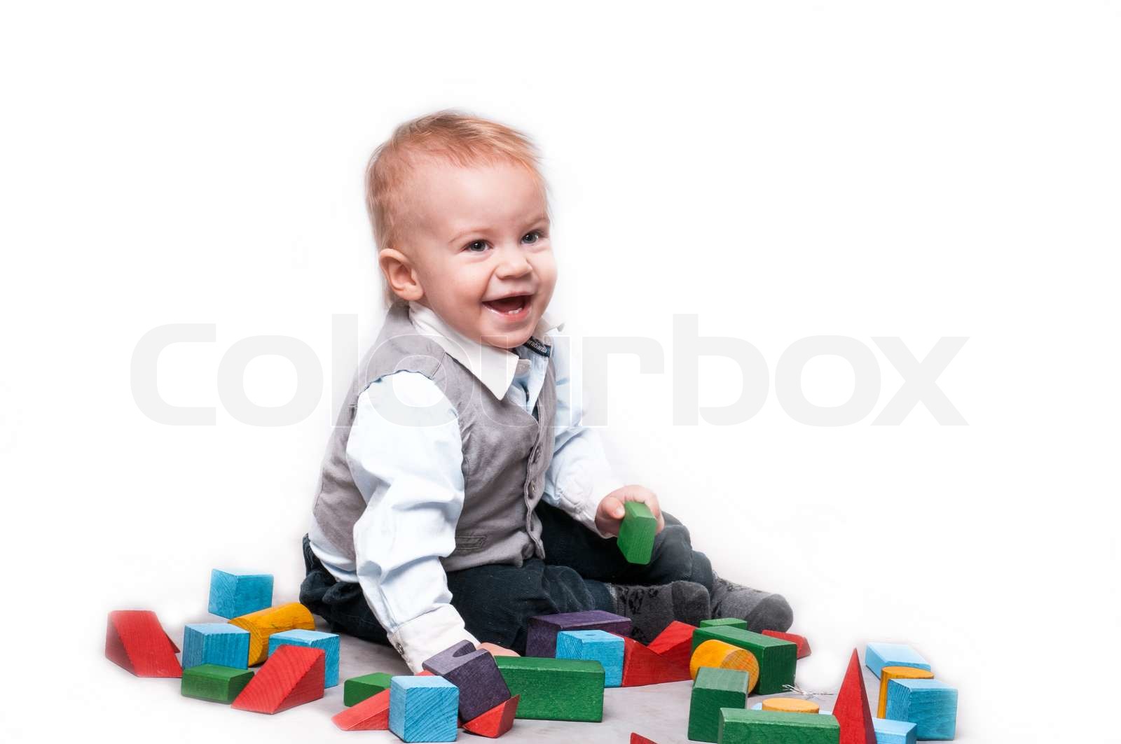baby playing with blocks on an isolated background | Stock image ...