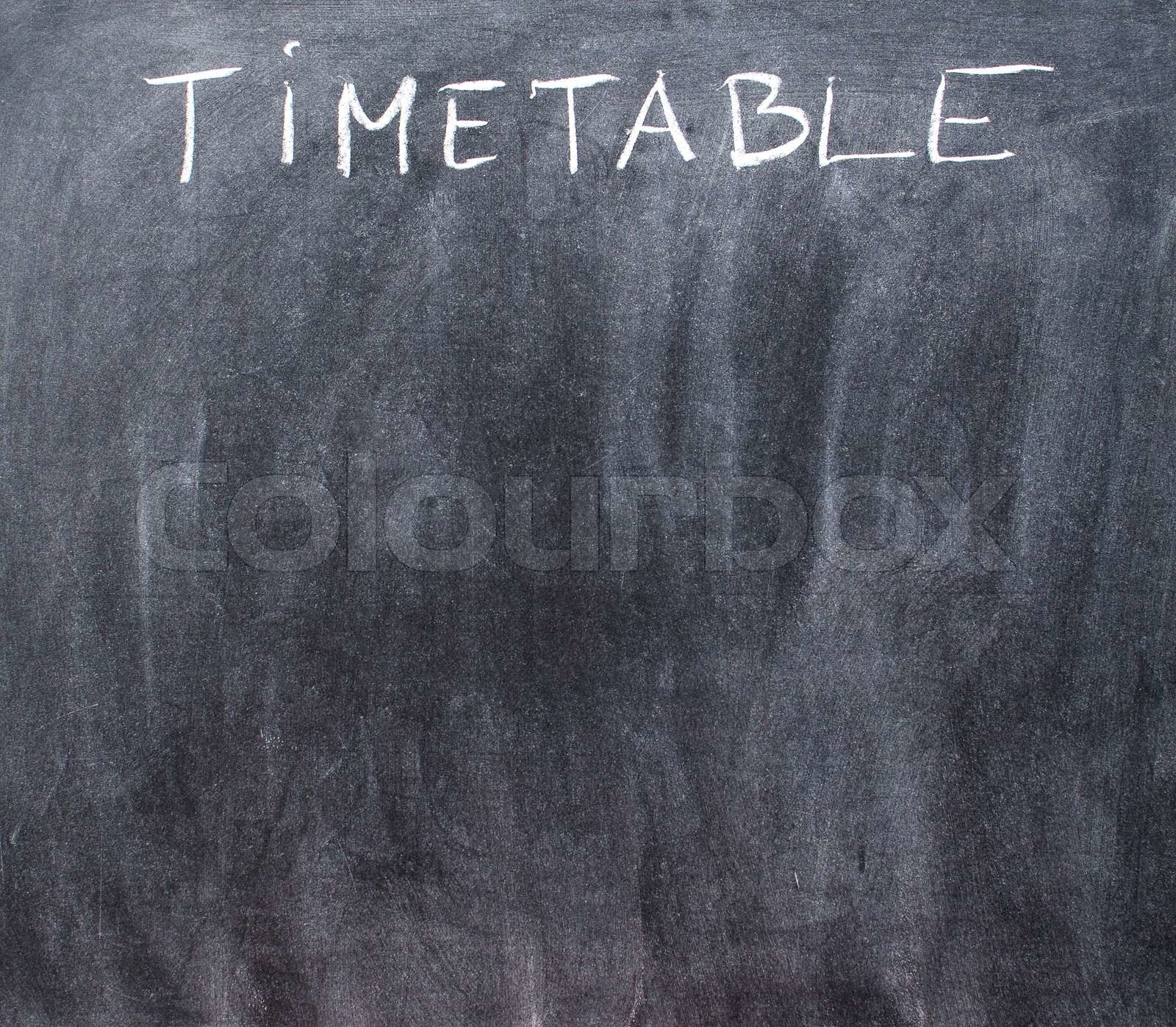 Word timetable written with chalk on blackboard | Stock image | Colourbox
