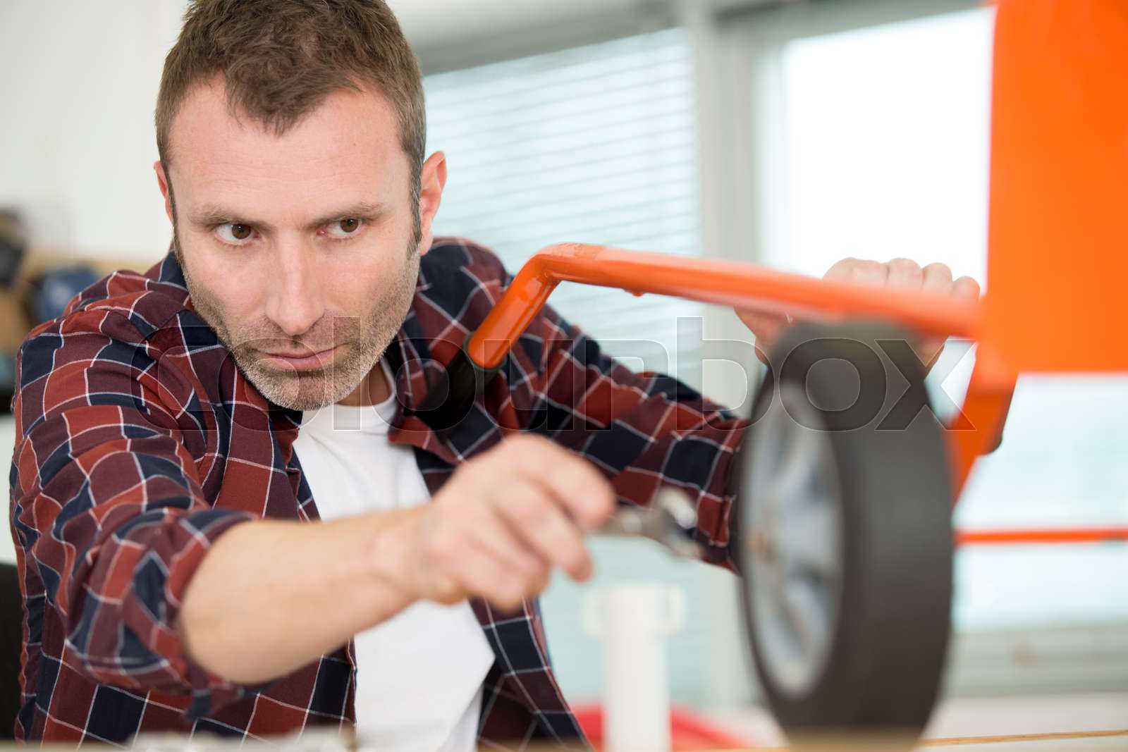man working trolley wheels | Stock image | Colourbox