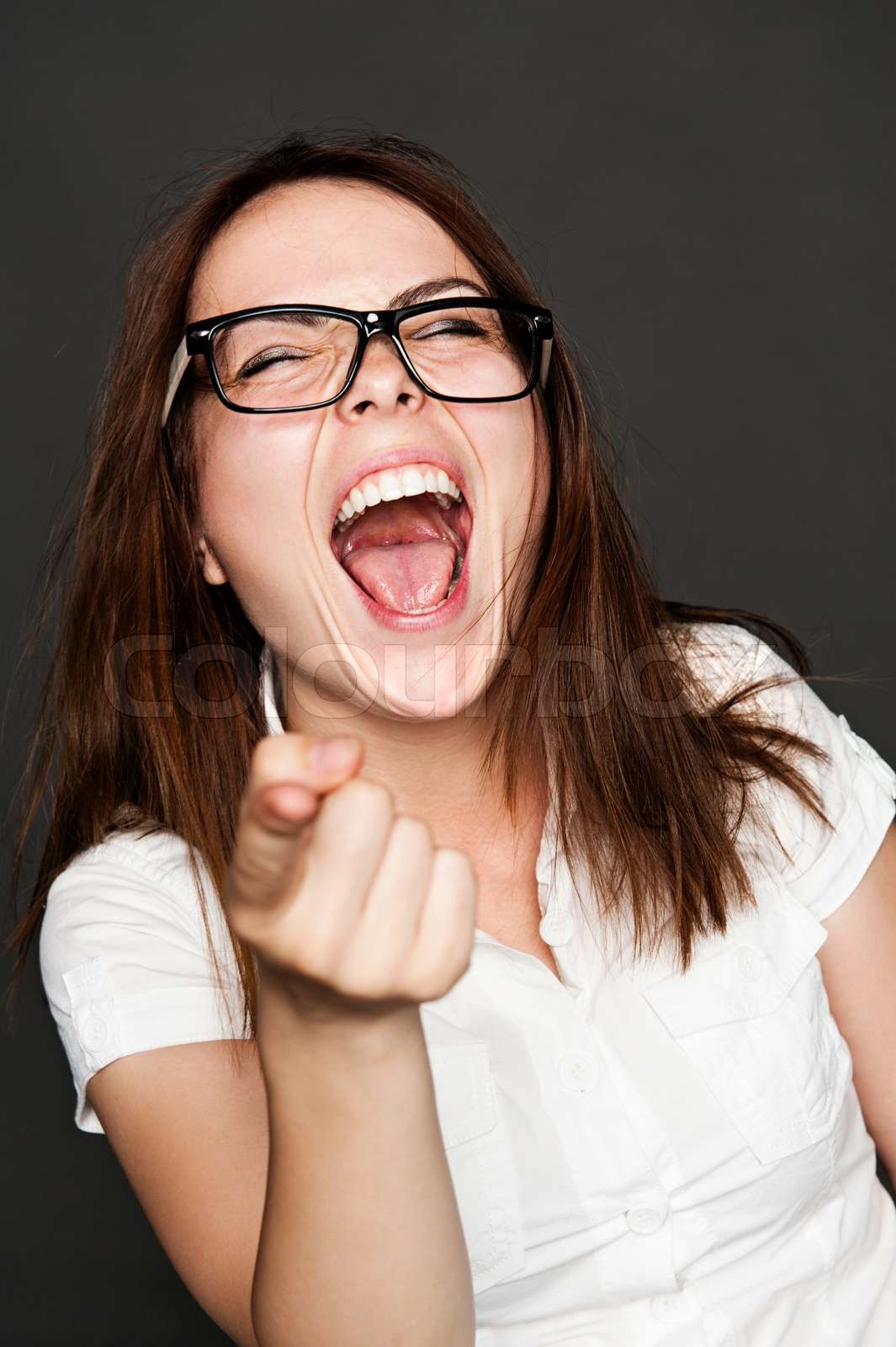 woman pointing finger and laughing | Stock image | Colourbox