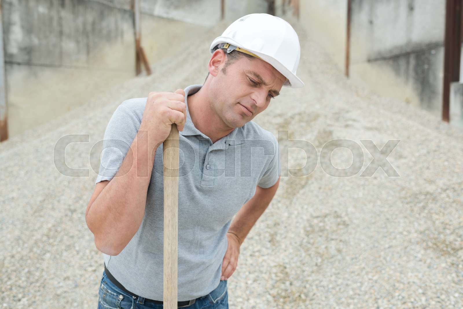 middle-aged construction worker with back pain | Stock image | Colourbox