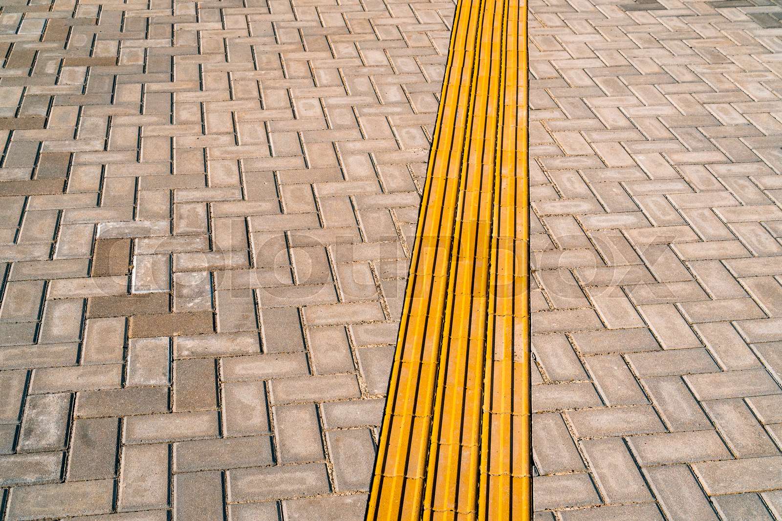Tactile paving on pedestrian walkway | Stock image | Colourbox