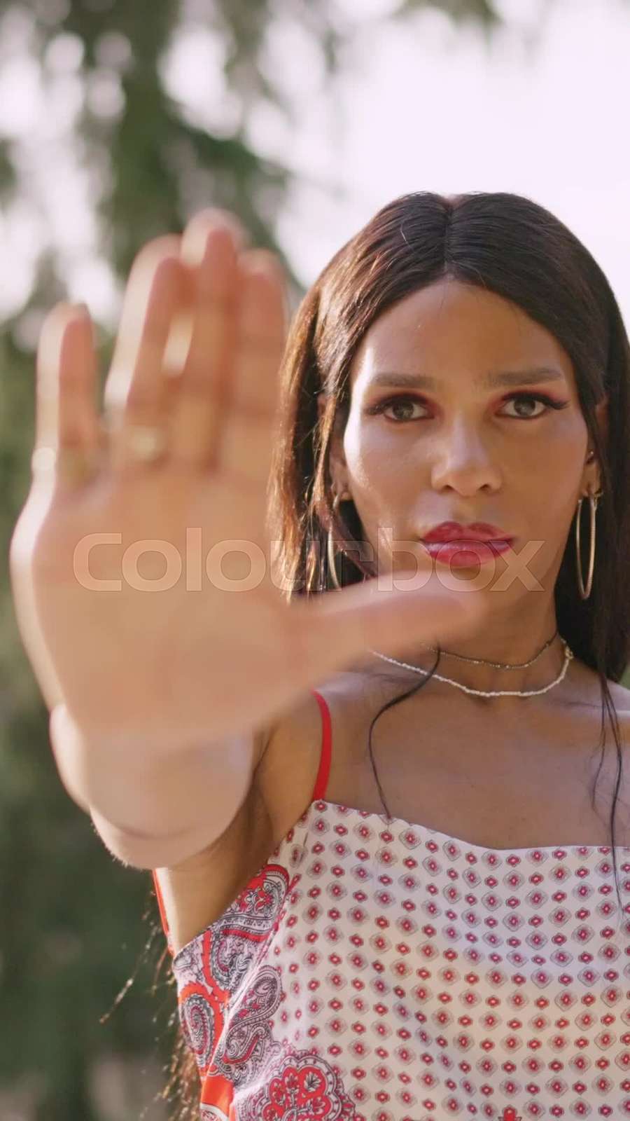 Transgender woman extending the hand in stop sign | Stock video | Colourbox Transgender woman extending the hand in stop sign | Stock video | Colourbox