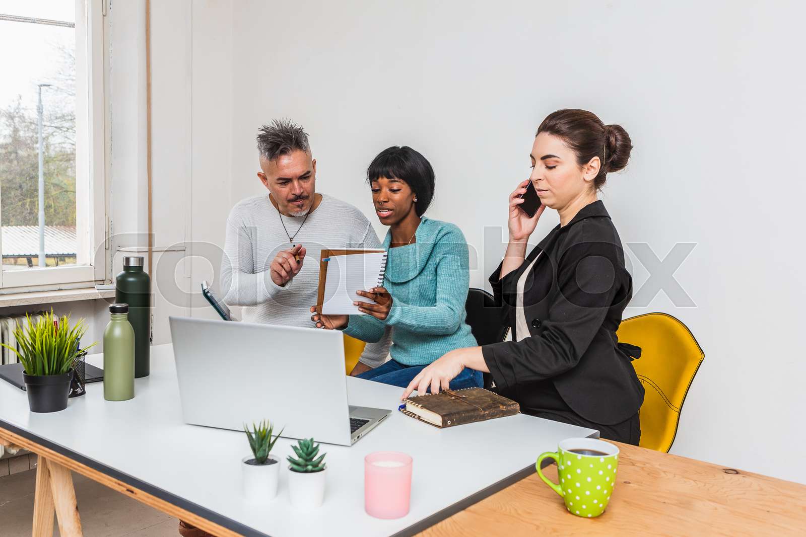 Co-workers showing agenda with schedule to boss - Stock Image - Everypixel