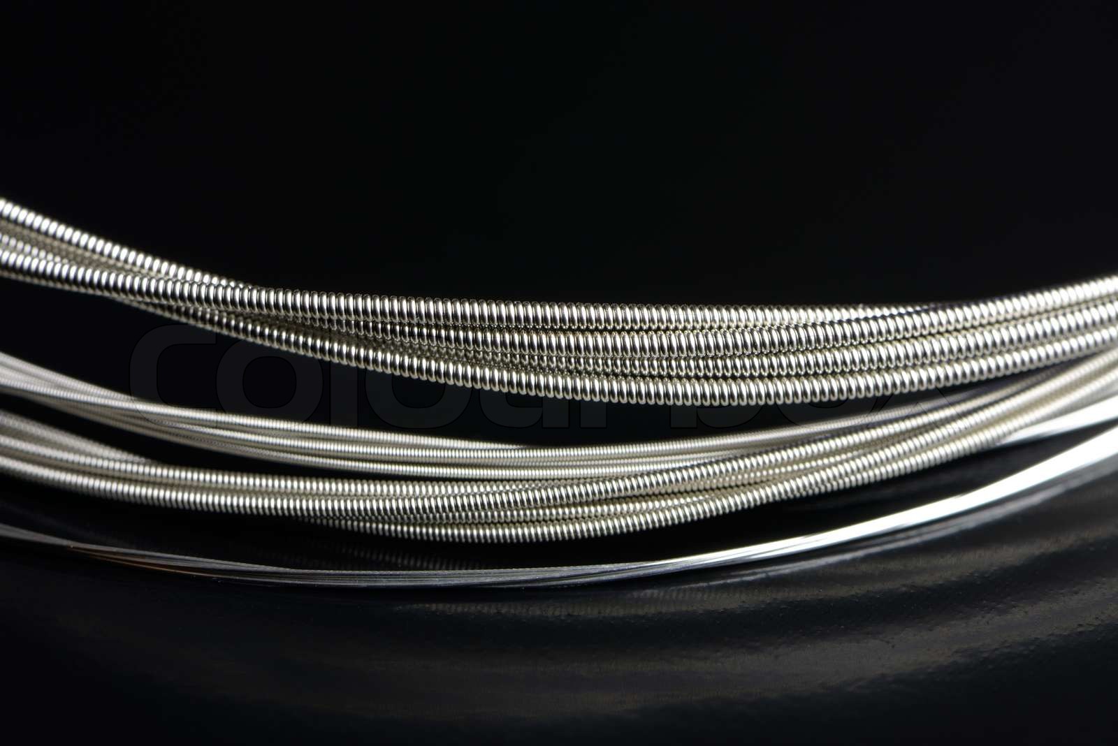 Guitar Strings Close-Up on Glossy Black Background | Stock image ...