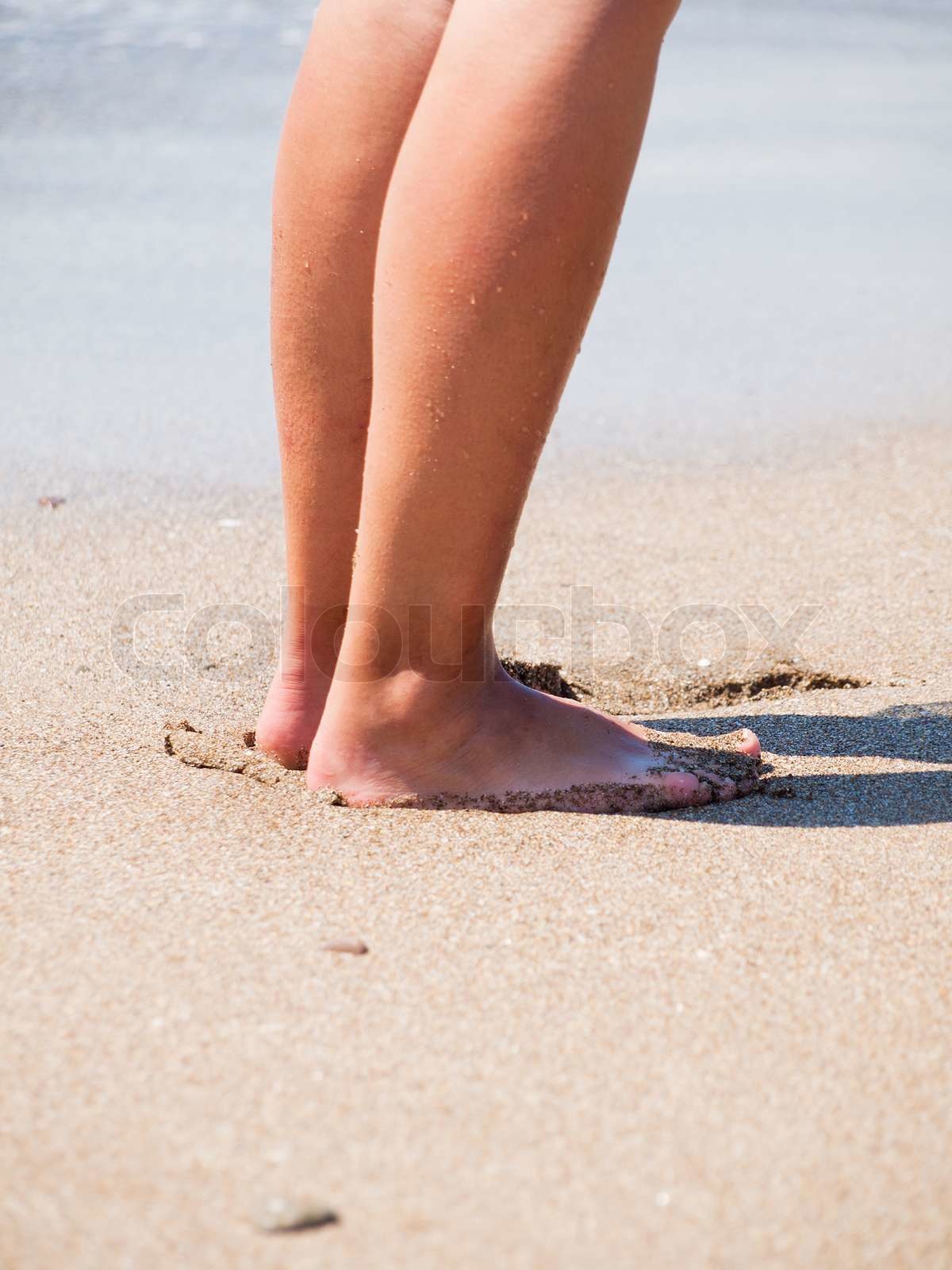 woman standing on the sand beach | Stock image | Colourbox