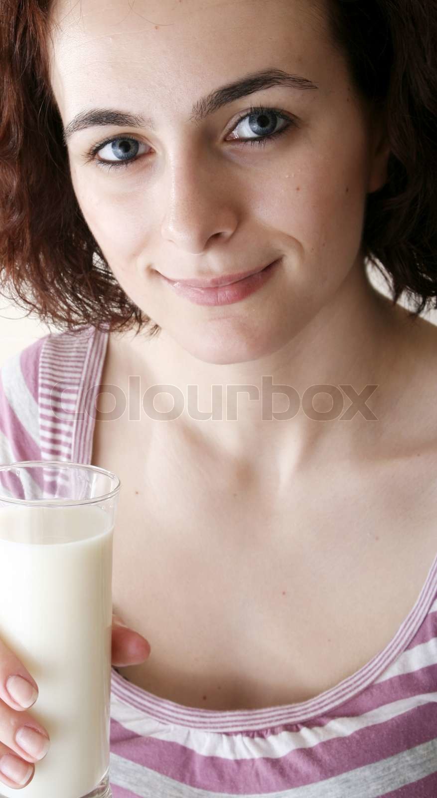 Young people eating milk with cereals | Stock image | Colourbox