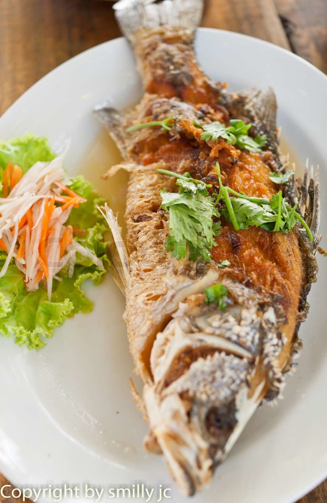 fried snapper with fishsauce on the plate | Stock image | Colourbox