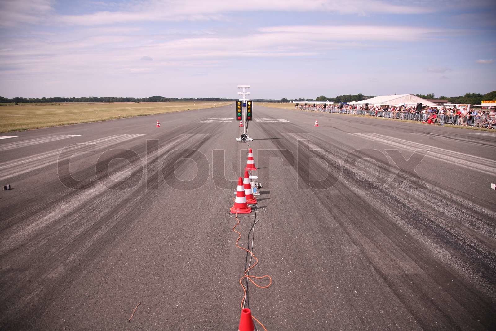 Crowd of people along racing track | Stock image | Colourbox