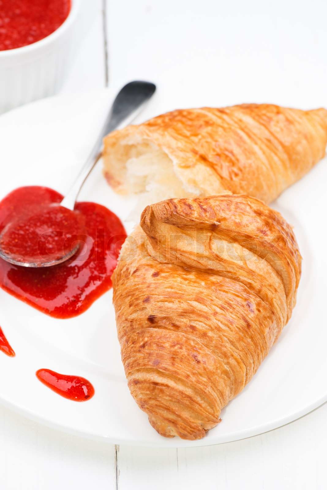 Croissant and strawberry jam | Stock image | Colourbox