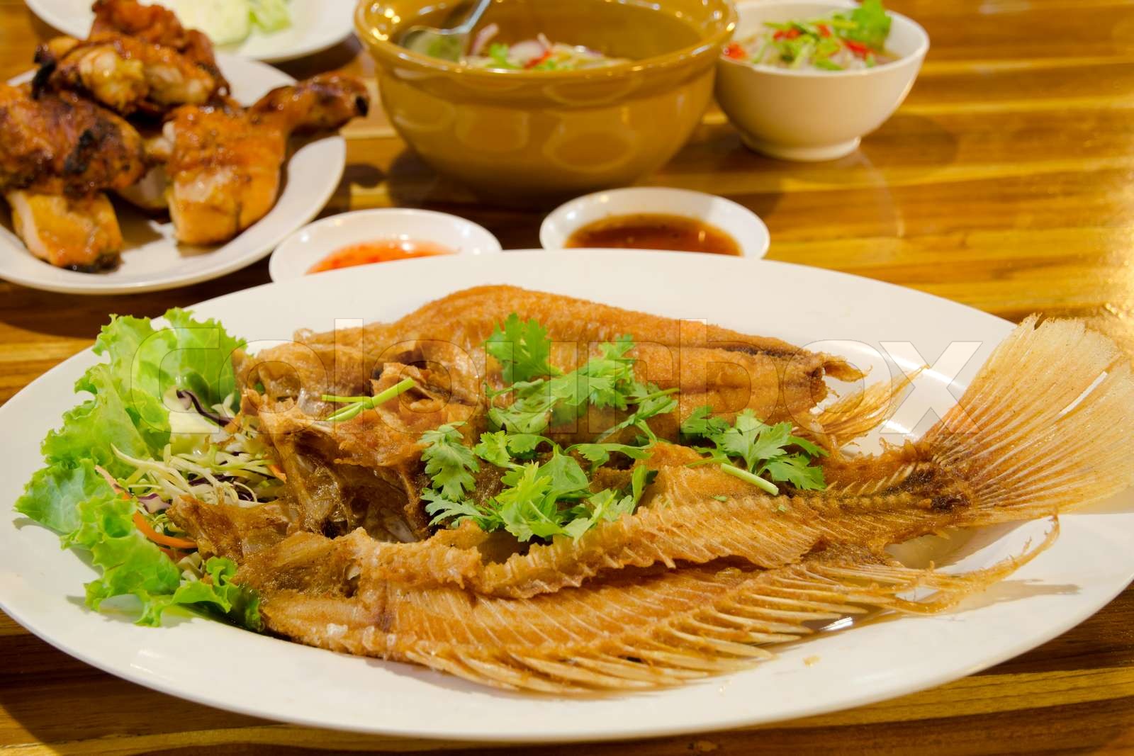 Fried snapper with fish sauce | Stock image | Colourbox